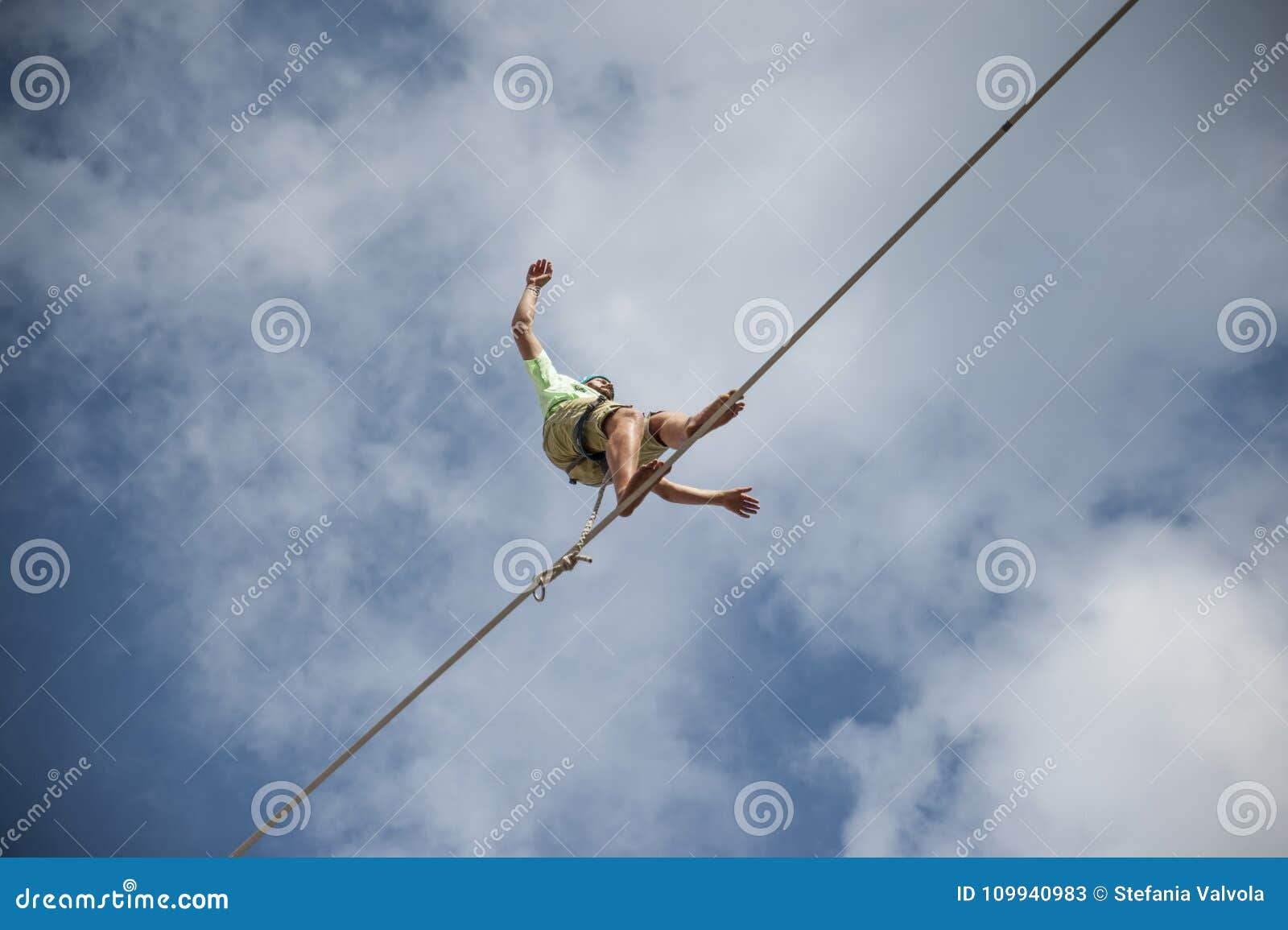 Tightrope Walker, Man Hanging on a Rope Walks in the Sky Editorial ...