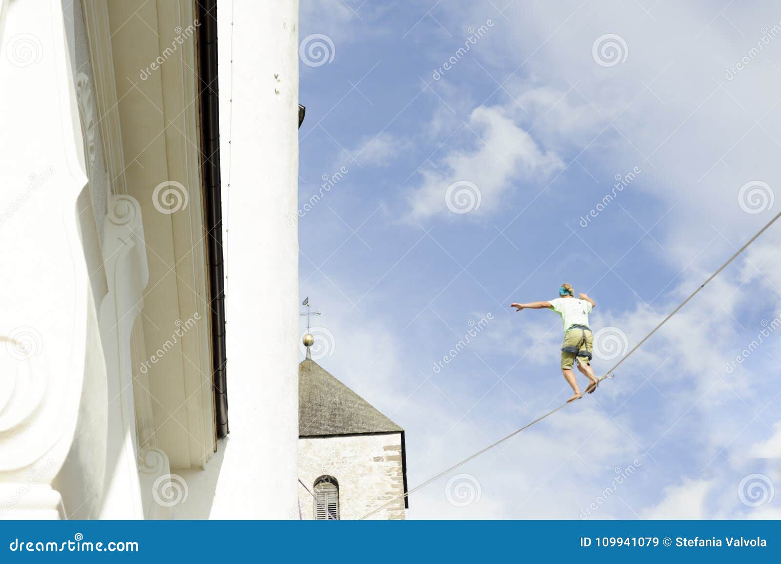 Tightrope Walker, Man Hanging on a Rope Walks in the Sky Editorial ...