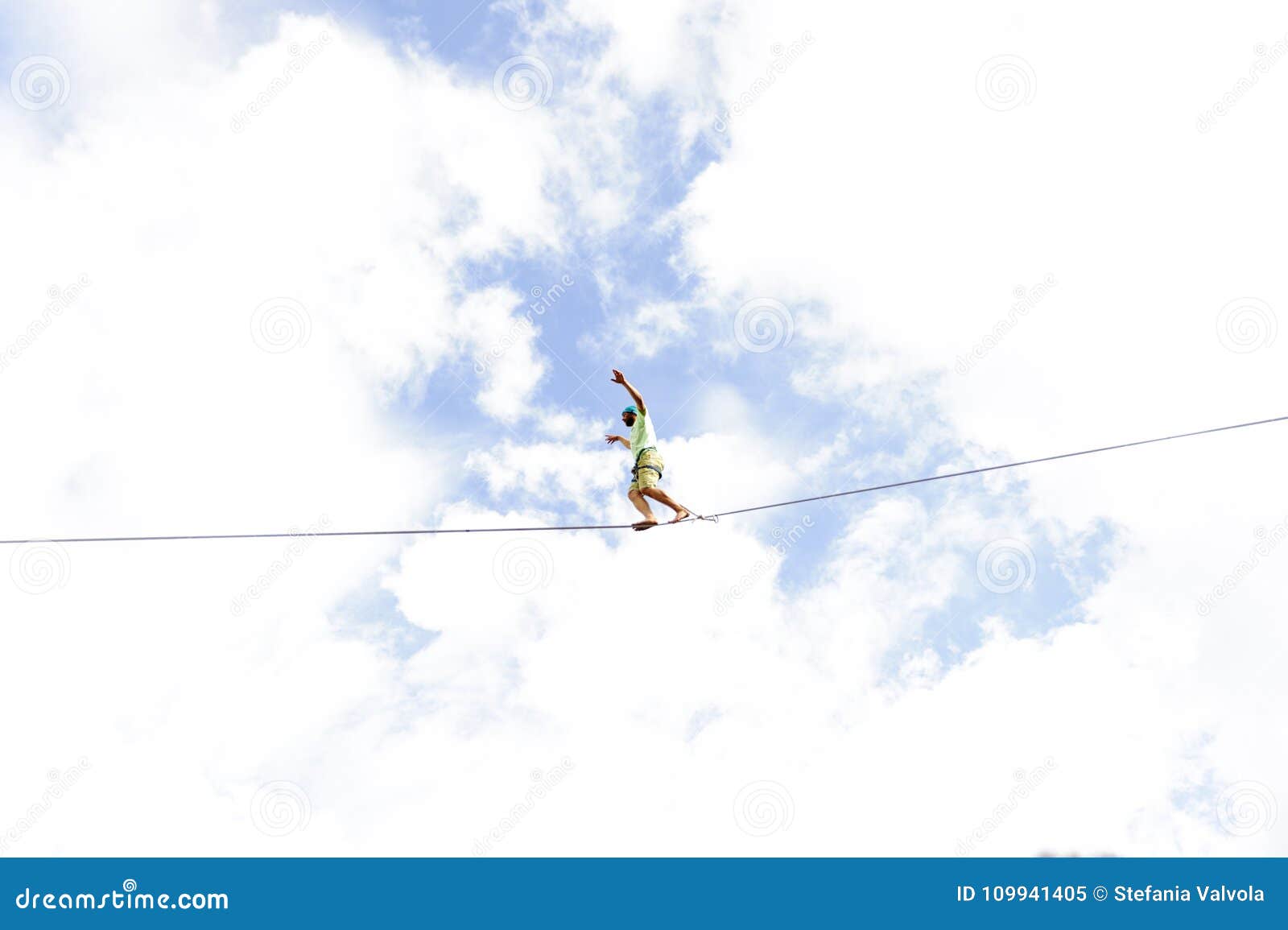 Tightrope Walker, Man Hanging on a Rope Walks in the Sky Editorial ...