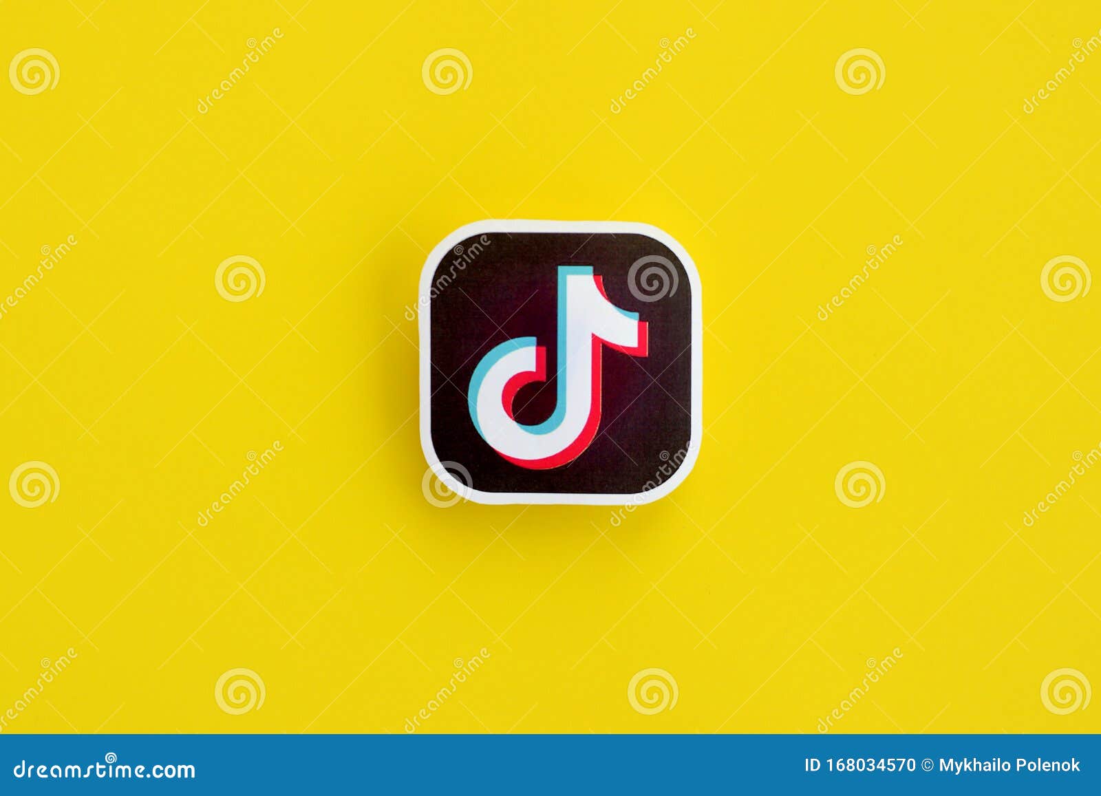 Tiktok Paper Logo On Yellow Background. TikTok Is A Popular Video ... Tiktok Paper Logo On Yellow Background. TikTok Is A Popular Video ...