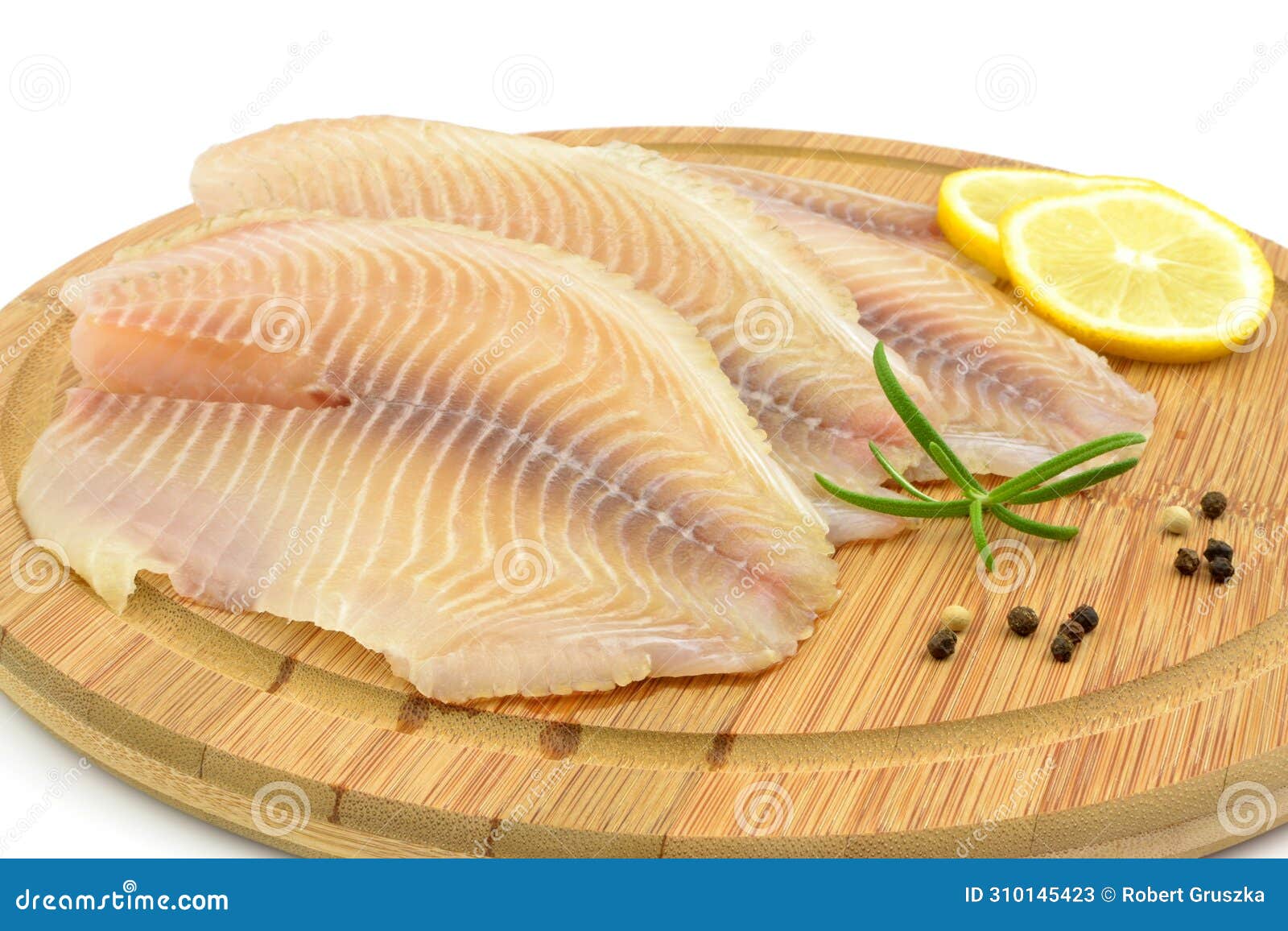Fillets Tilapia With Lemon On A Round Board Stock Photography ...