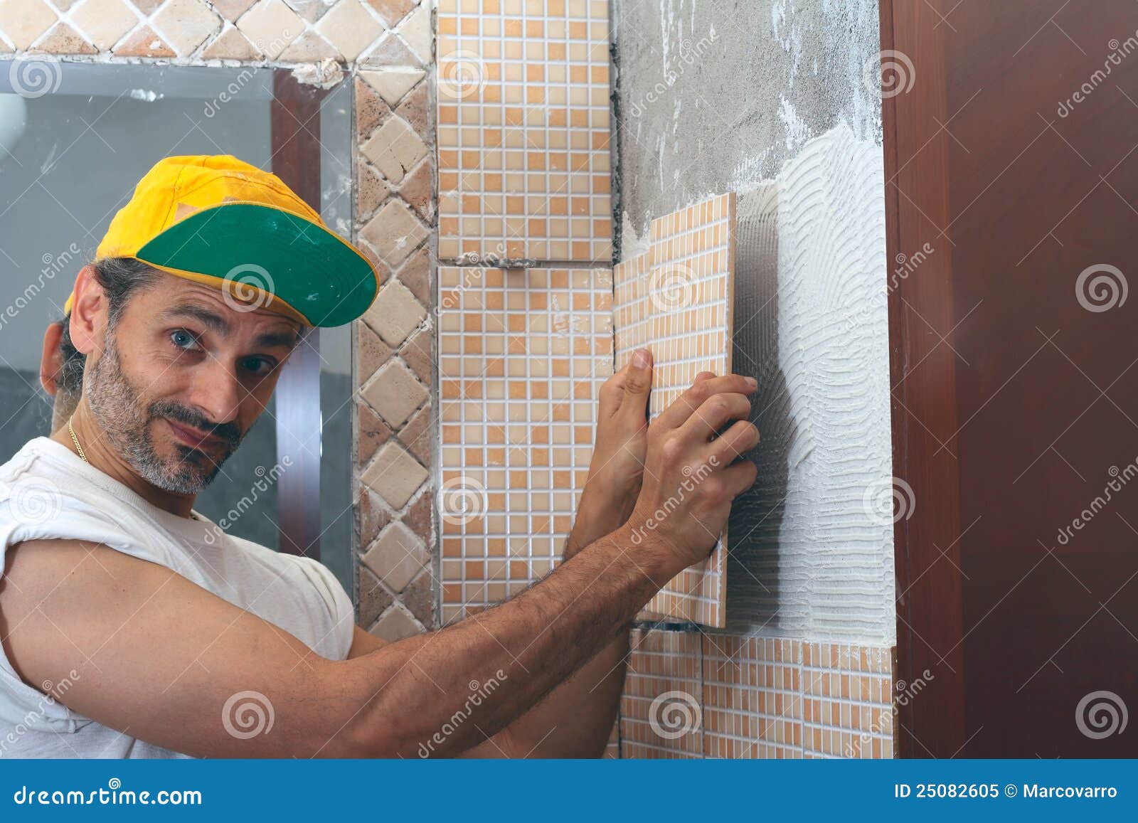 Tile adhesive installation stock image. Image of artisan - 25082605