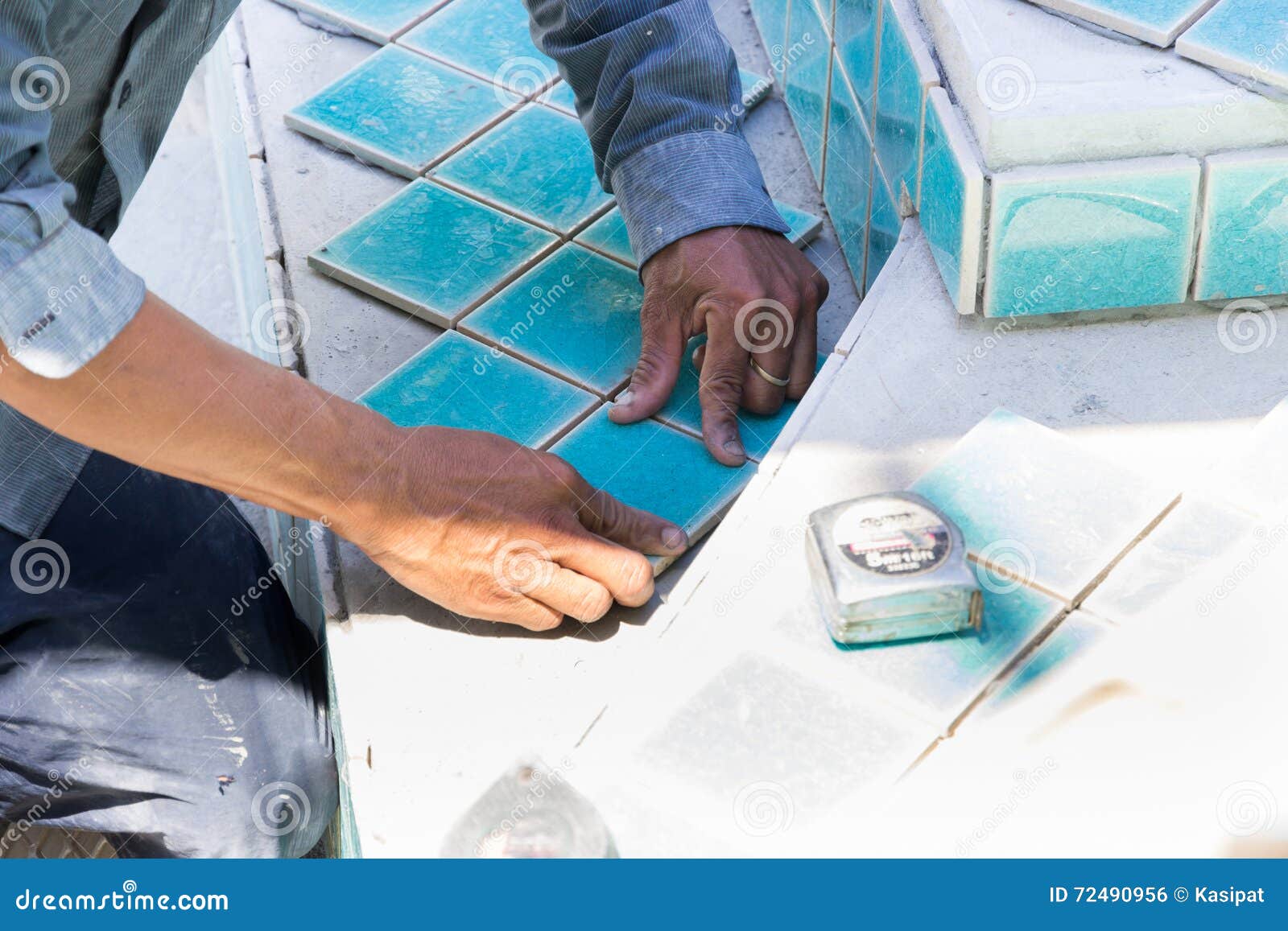 Tile builder swimming pool stock photo. Image of builder - 72490956