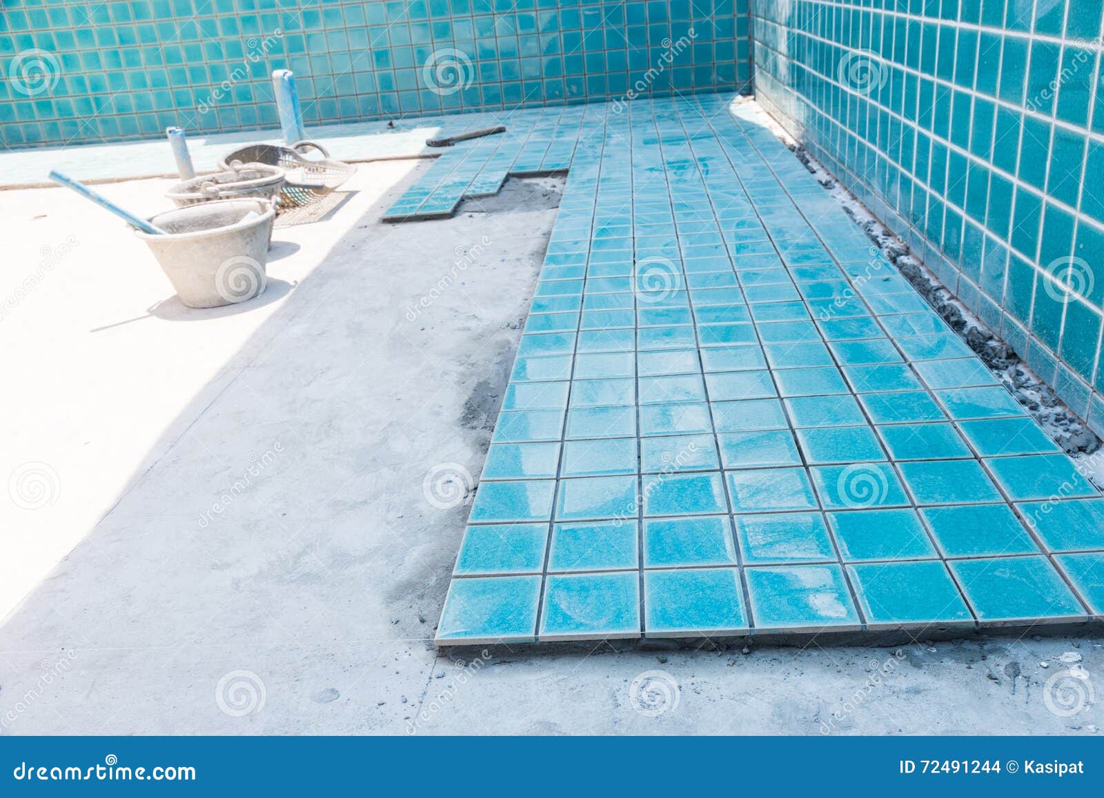 Tile builder swimming pool stock photo. Image of laying - 72491244