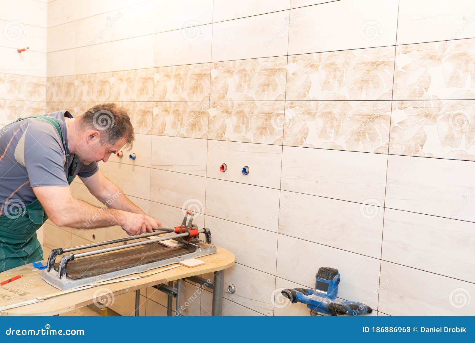 Cutting Ceramic Tiles with a Special Hand Machine with a Sharp Diamond ...