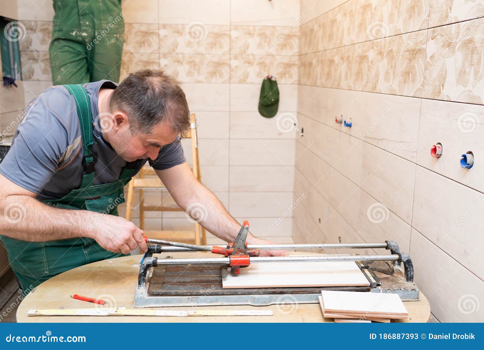 Cutting Ceramic Tiles with a Special Hand Machine with a Sharp Diamond ...