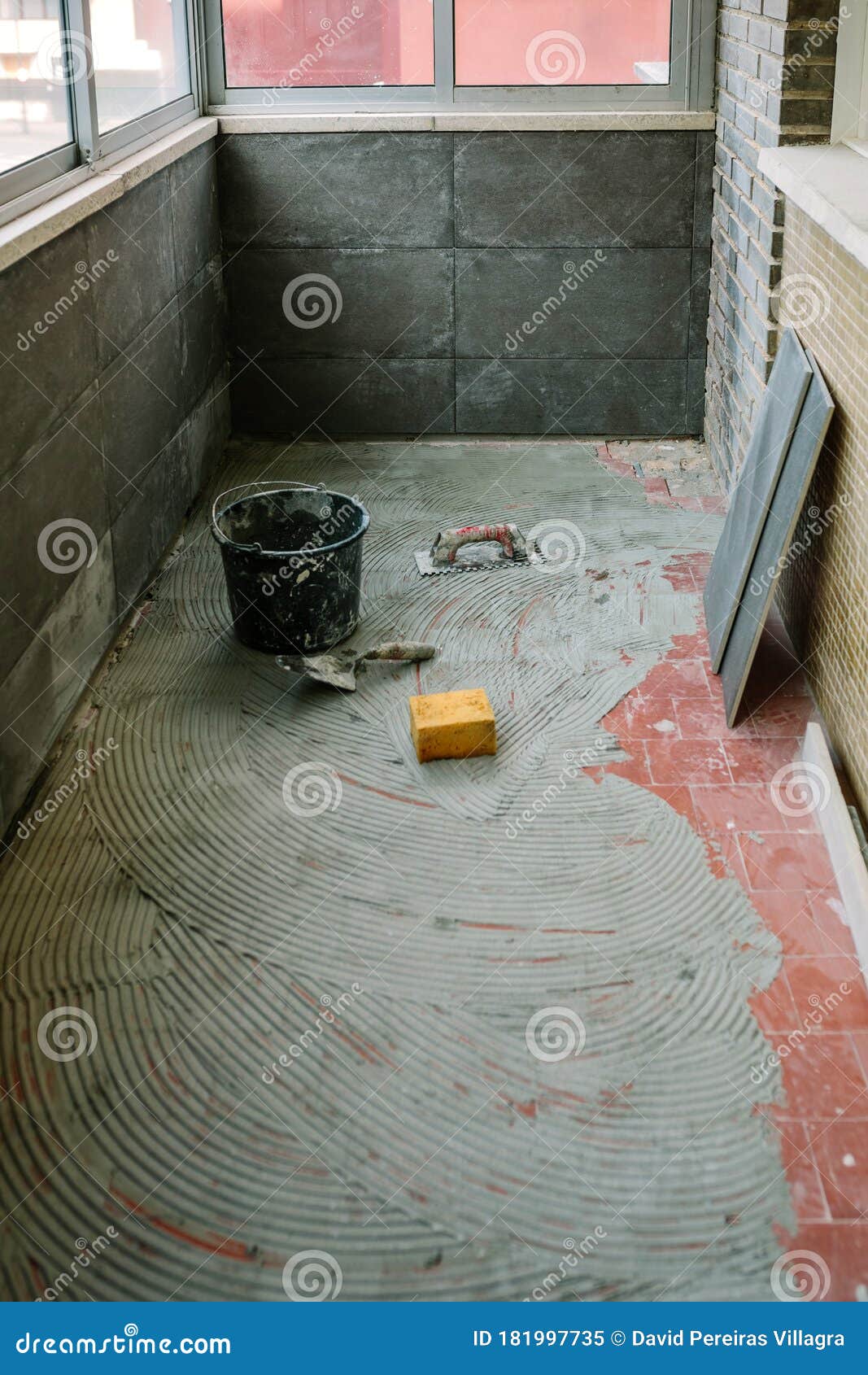 Tile laying work on floor stock image. Image of floor - 181997735