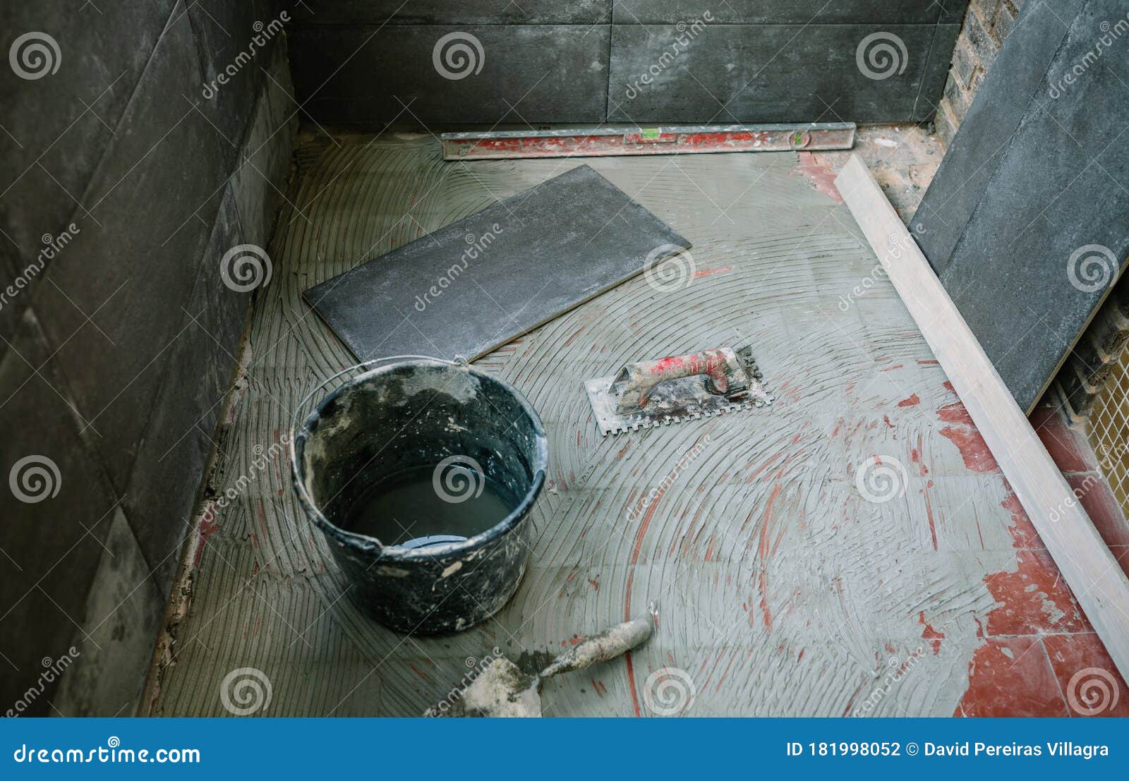 Tile laying work on floor stock photo. Image of mortar - 181998052