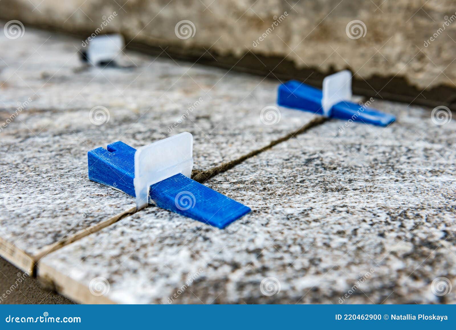 Tile Leveling System with Plastic Clips and Wedges on the Steps. Stock ...