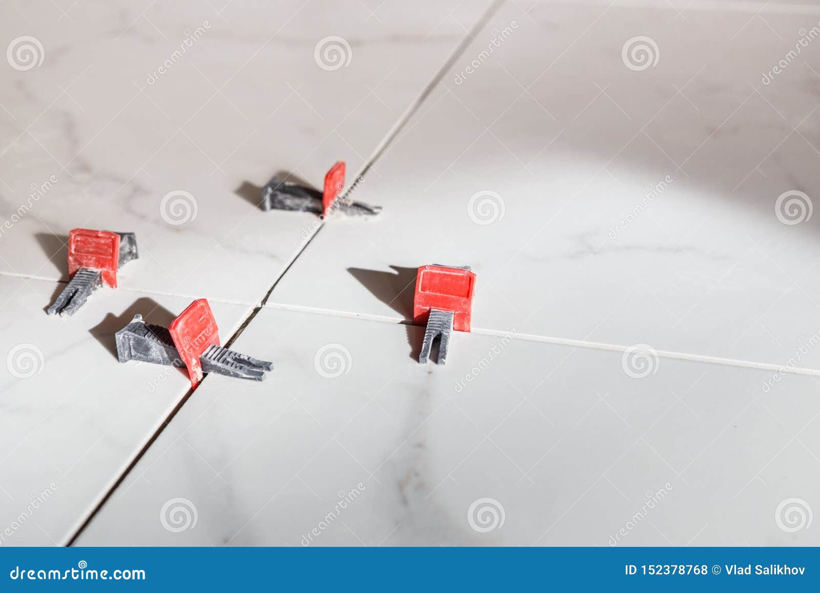 Tile Leveling System with Plastic Clips and Wedges Stock Photo - Image ...