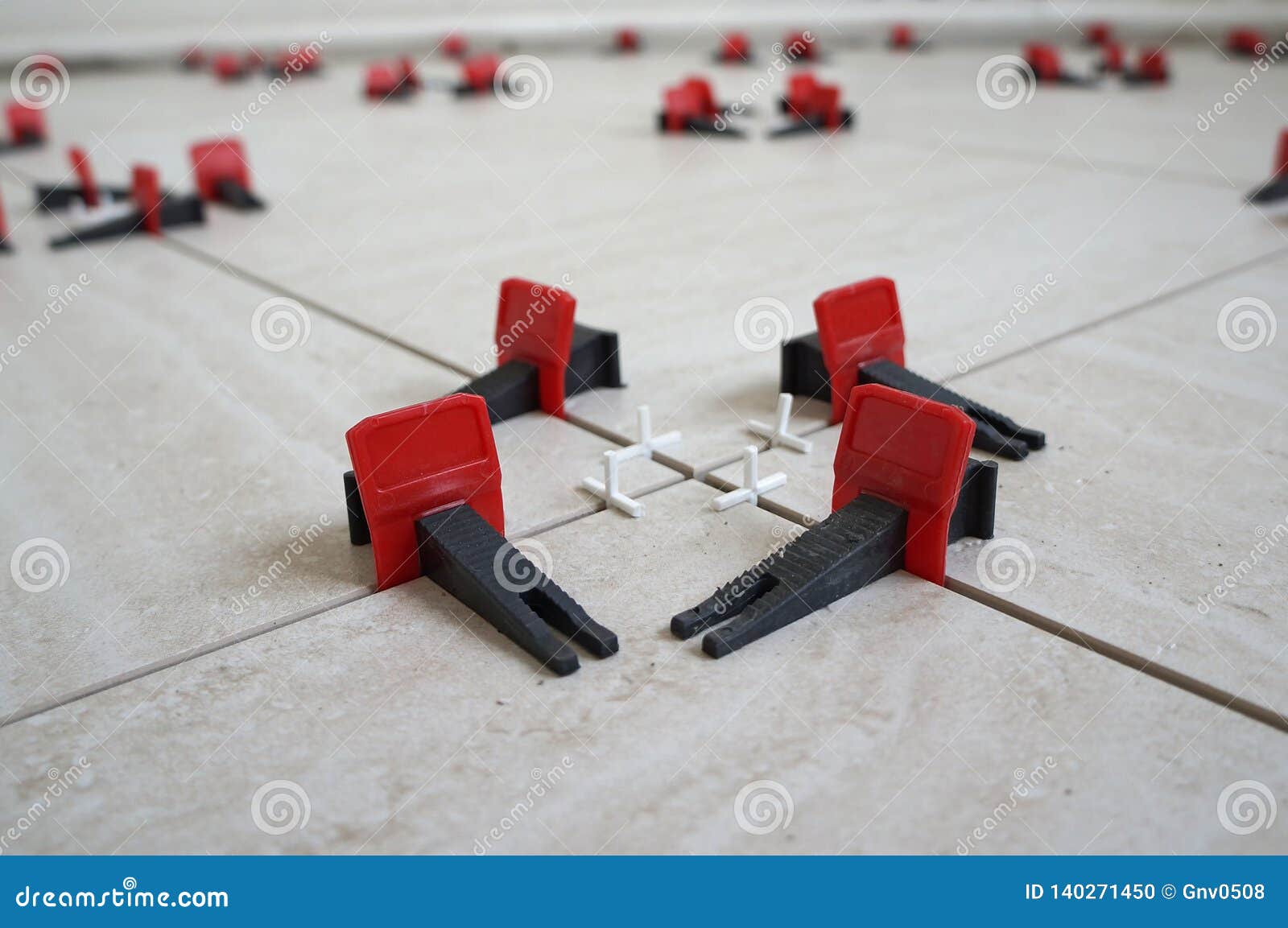 Tile Levelling System with Plastic Clips and Wedges. Close-up View ...