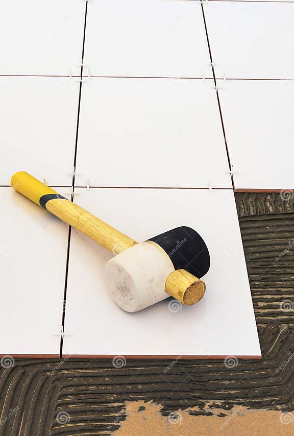 Tile and mallet. stock image. Image of mirror, design - 67399417