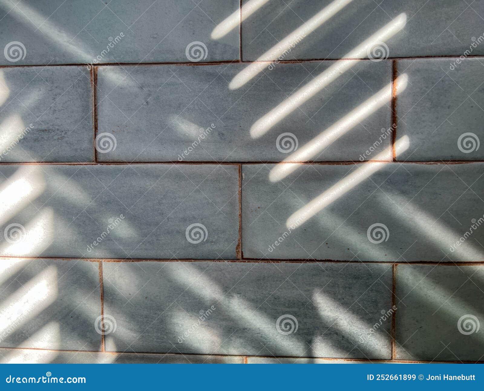 A Tile Wall in a Bathroom with Shadows Stock Image - Image of aqua ...