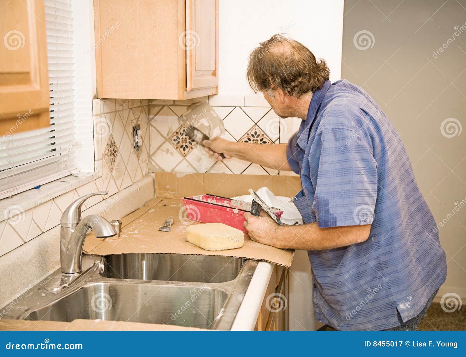 Tile Work - Applying Grout stock image. Image of labor - 8455017