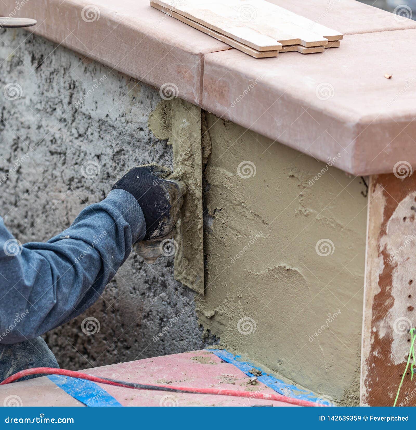 Tile Worker Applying Cement with Trowel at Pool Construction Site Stock ...