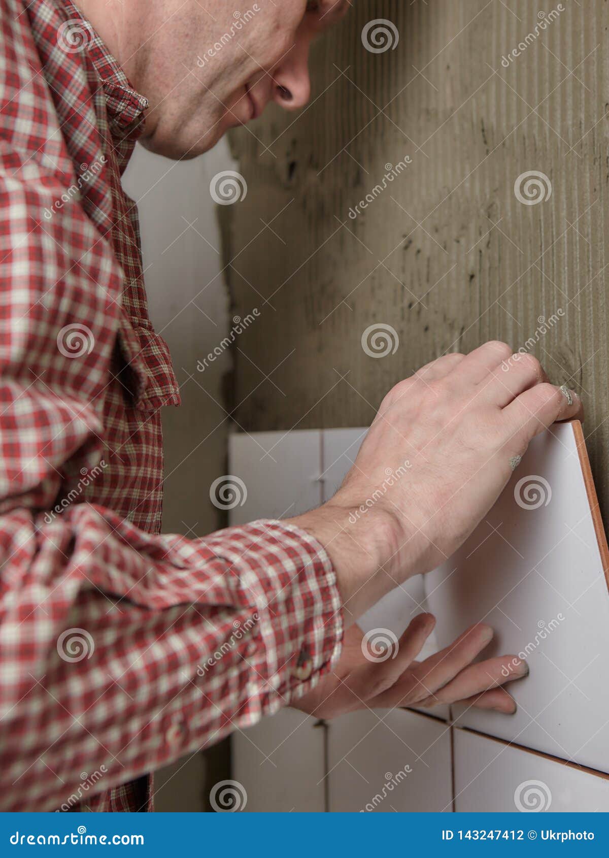 Tiler Installing Ceramic Tiles on a Wall Stock Photo - Image of tiles ...