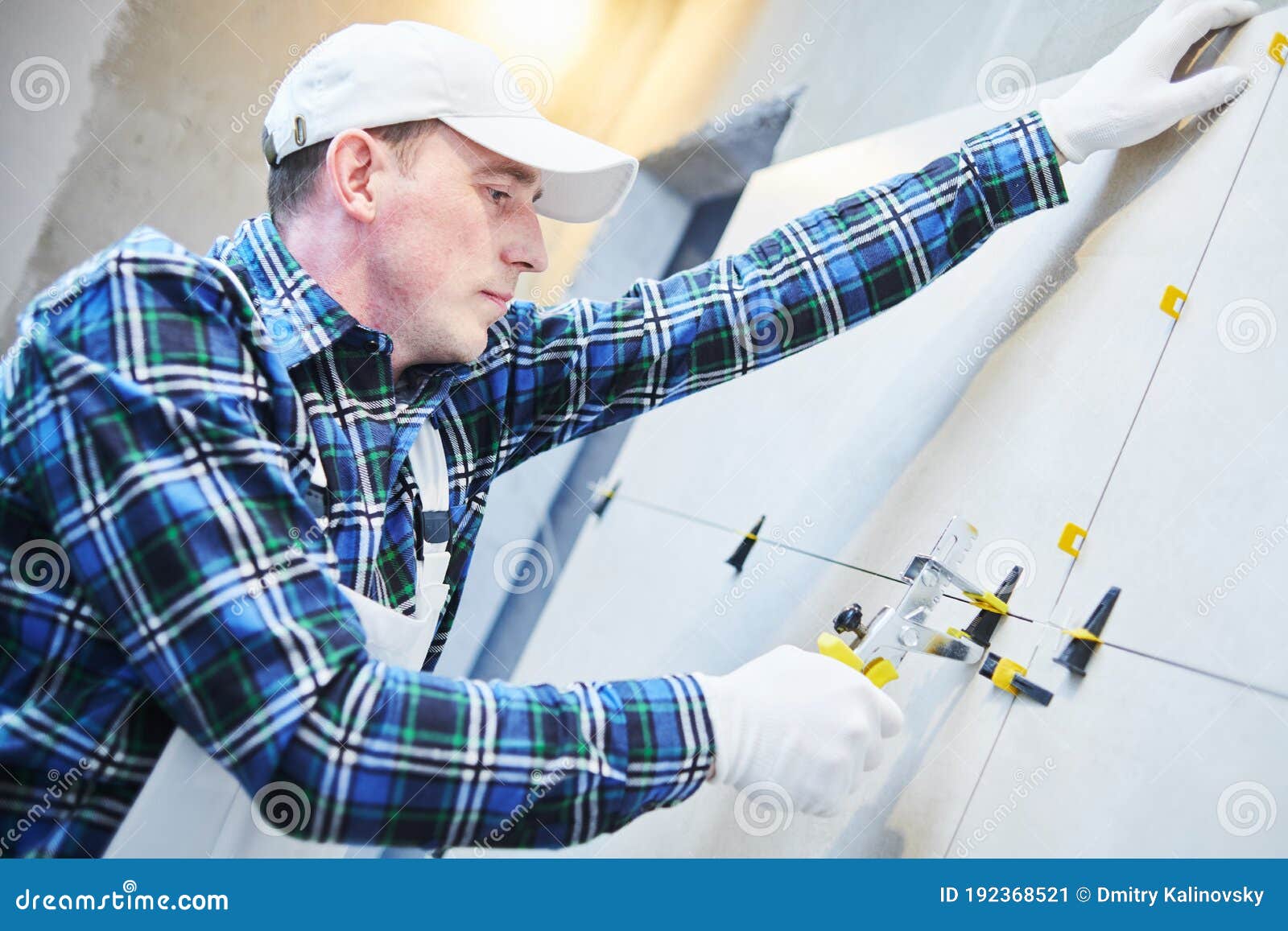 Tiler Installing Large Format Tile on Wall. Tile Leveling System Stock ...