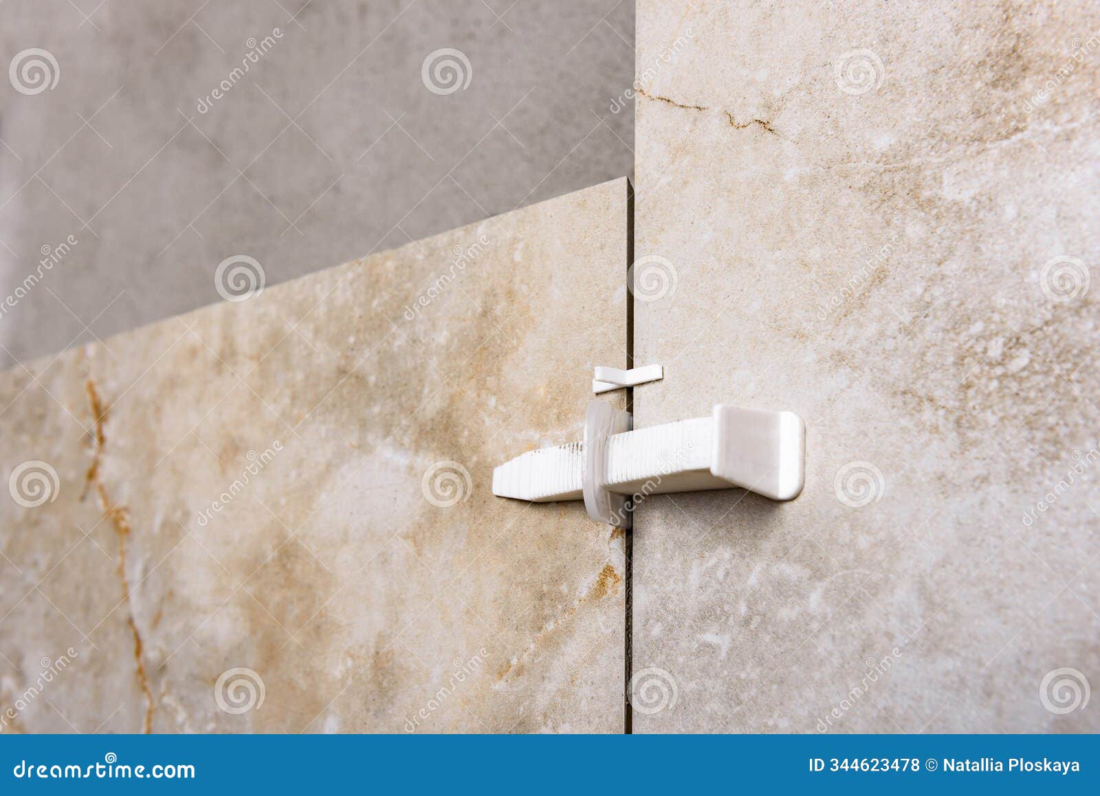 Tiler Installing Leveling System Tiles on Wall. Stock Photo - Image of ...