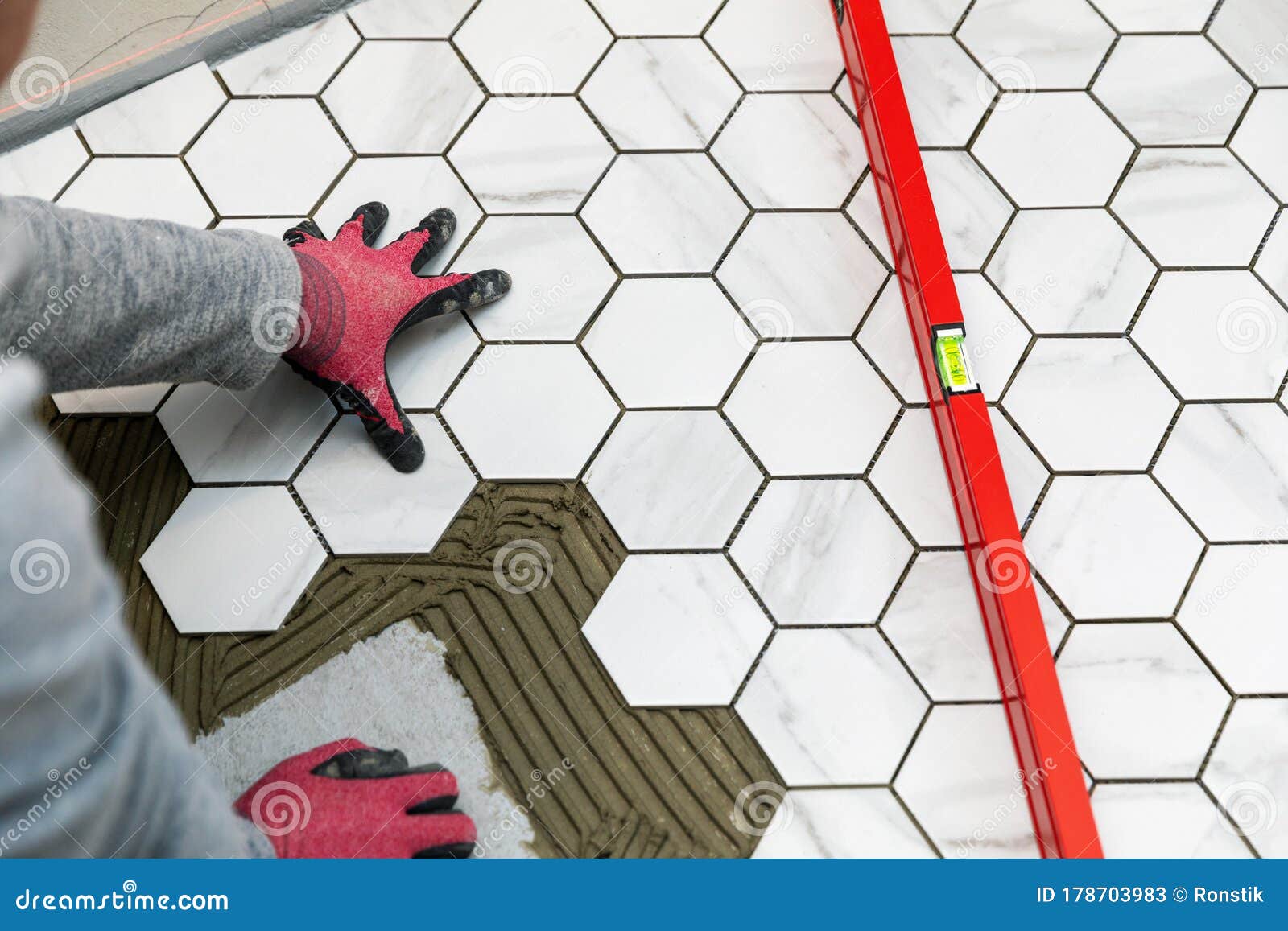 Tiler Laying Marble Texture Hexagon Tiles on the Floor Stock Image ...