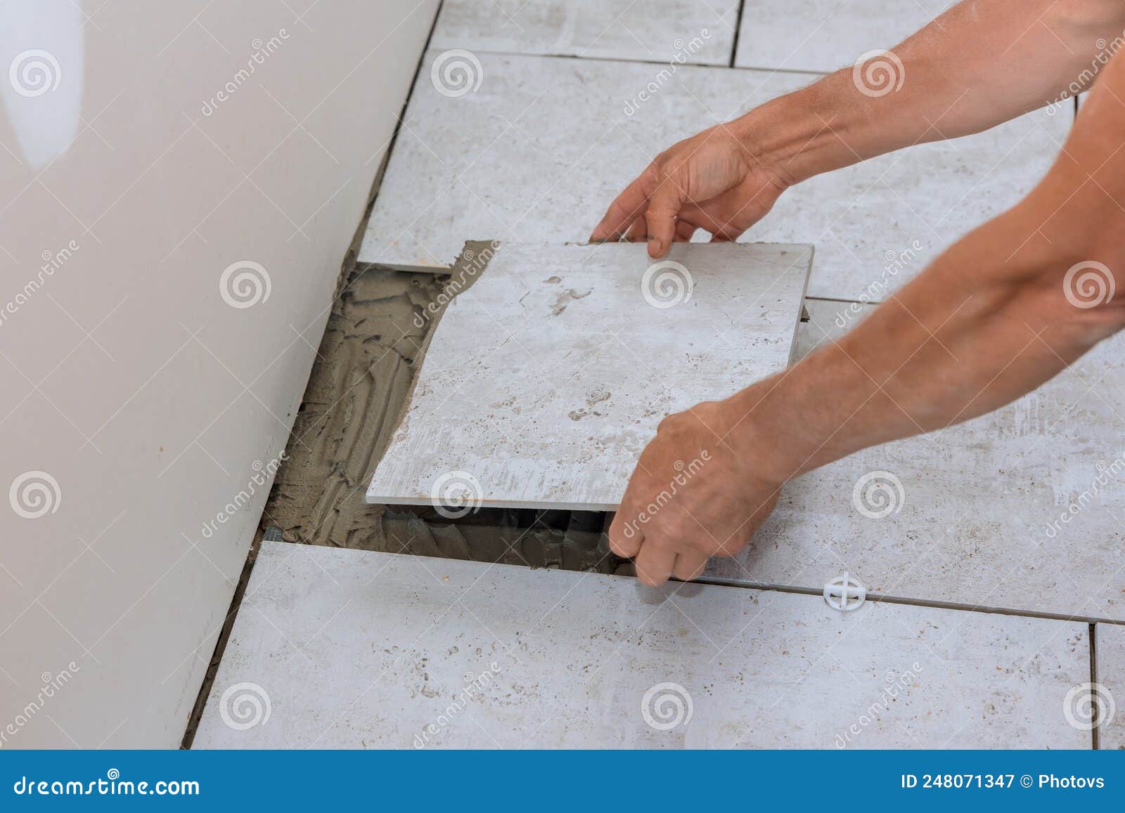 Tiler Placing Ceramic Floor Tile in Position Over Adhesive Stock Image ...