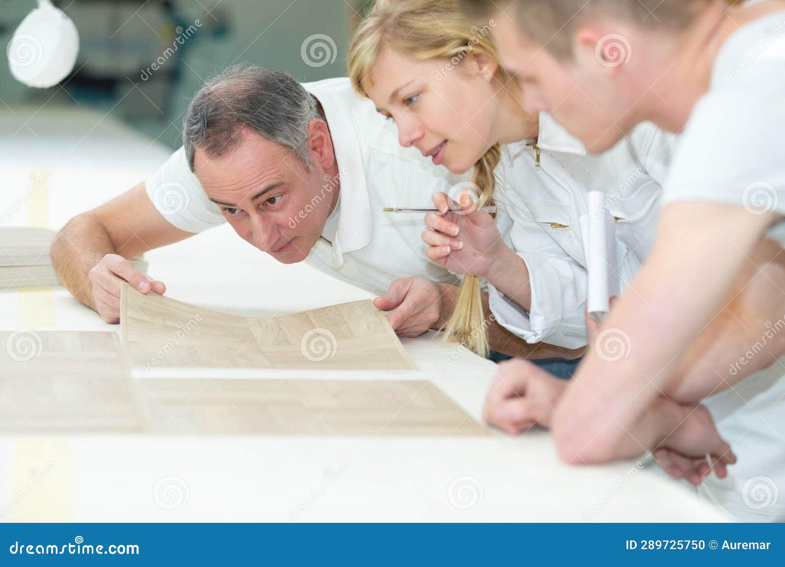 Tiler Showing Apprentice How To Place Boards Stock Photo - Image of ...