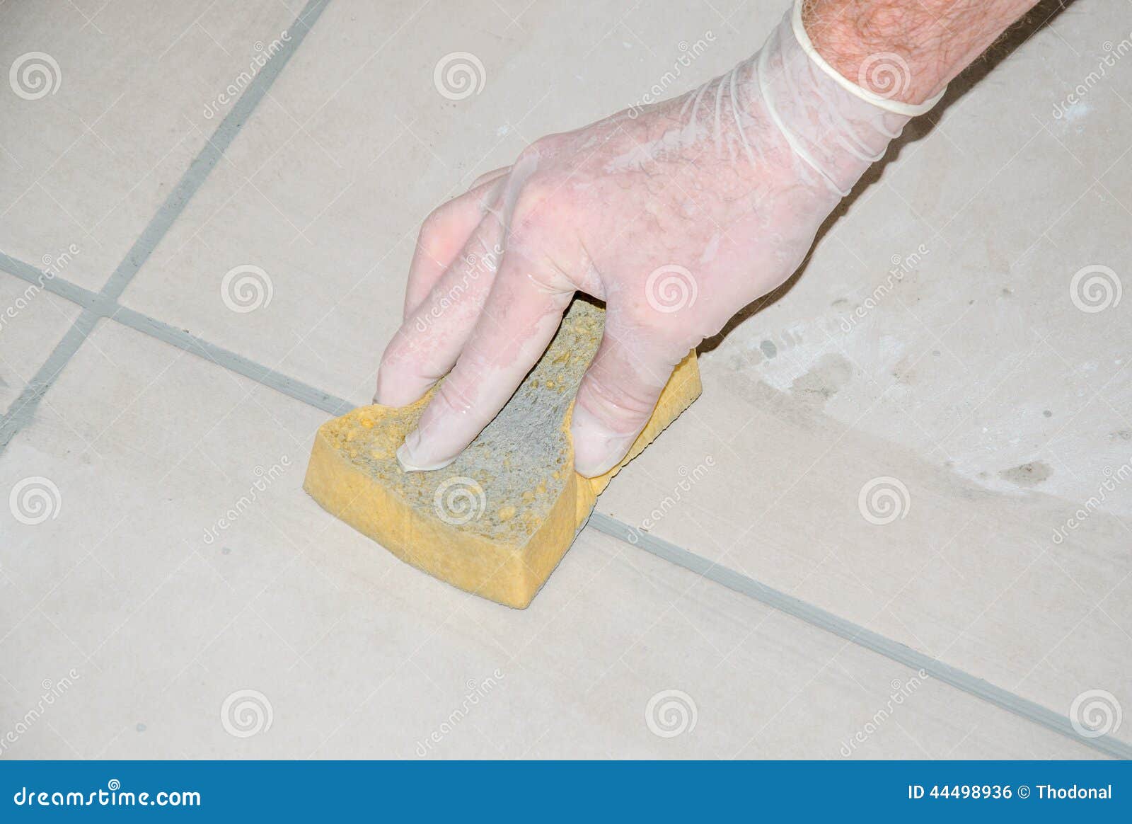Tiler Smoothing Tile Joints with a Sponge Stock Photo - Image of ...