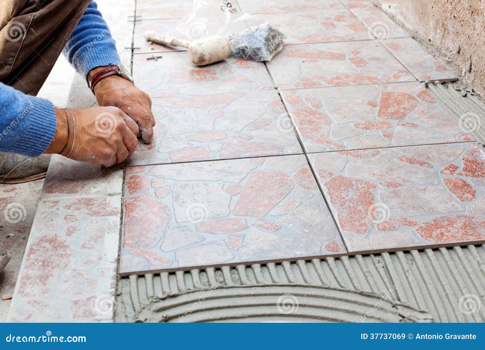 Tiler To Work with Tile Flooring Stock Image - Image of hand ...