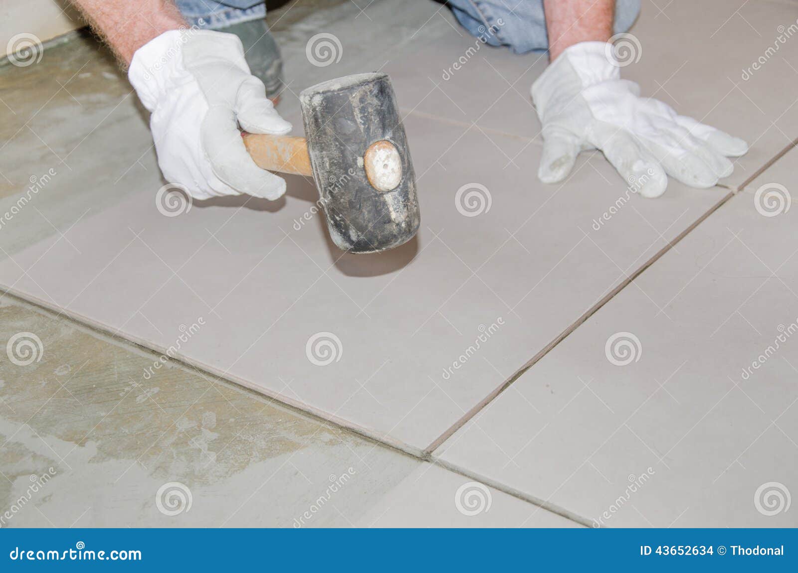 Tiler Using a Rubber Mallet Stock Photo - Image of installation, worker ...