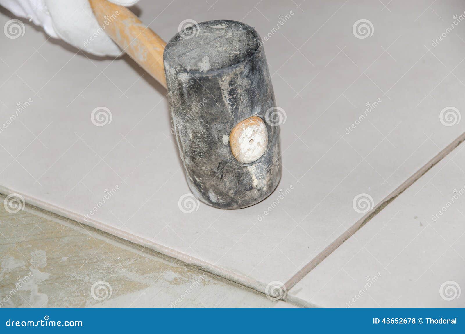 Tiler Using a Rubber Mallet Stock Photo - Image of home, mallet: 43652678