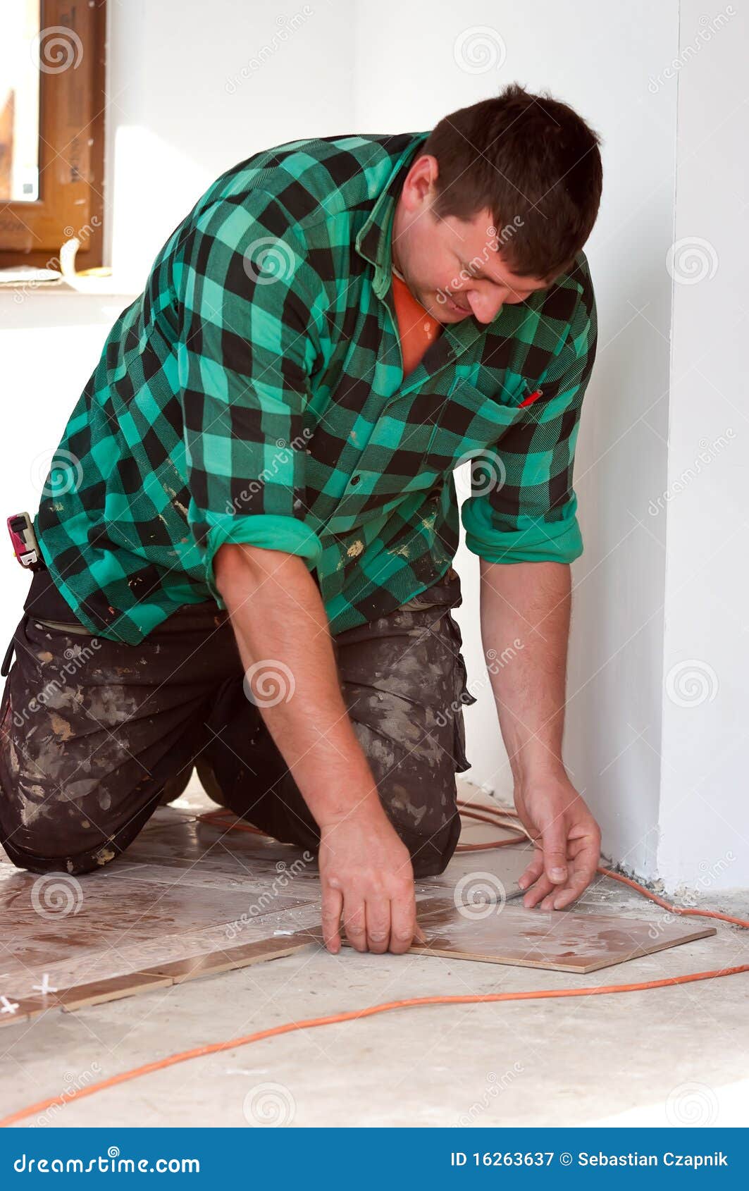 Tiler at work stock image. Image of smiling, improvement - 16263637