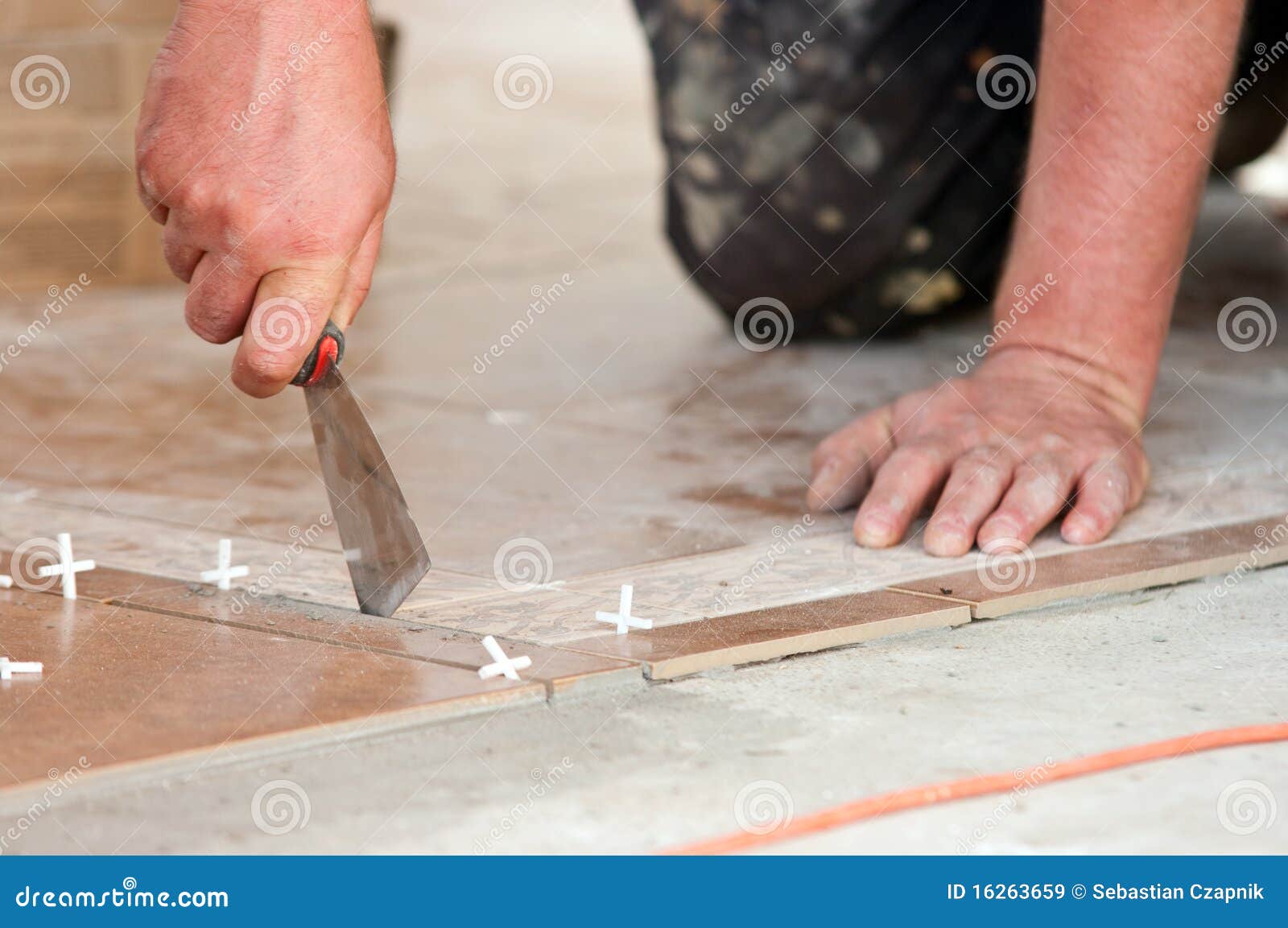 Tiler at work stock image. Image of close, crosses, improve - 16263659