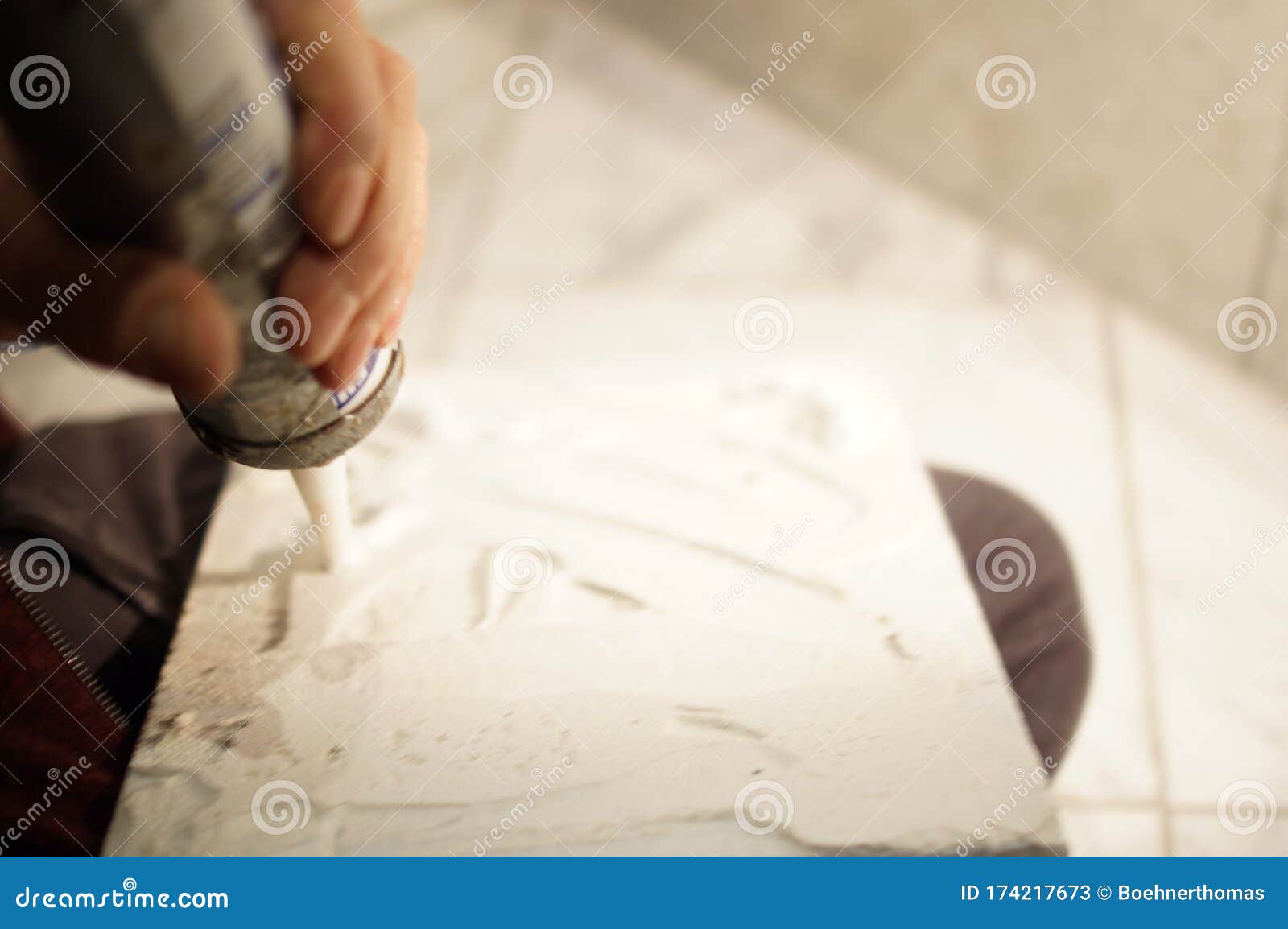 A tiler at work. stock image. Image of building, mason - 174217673