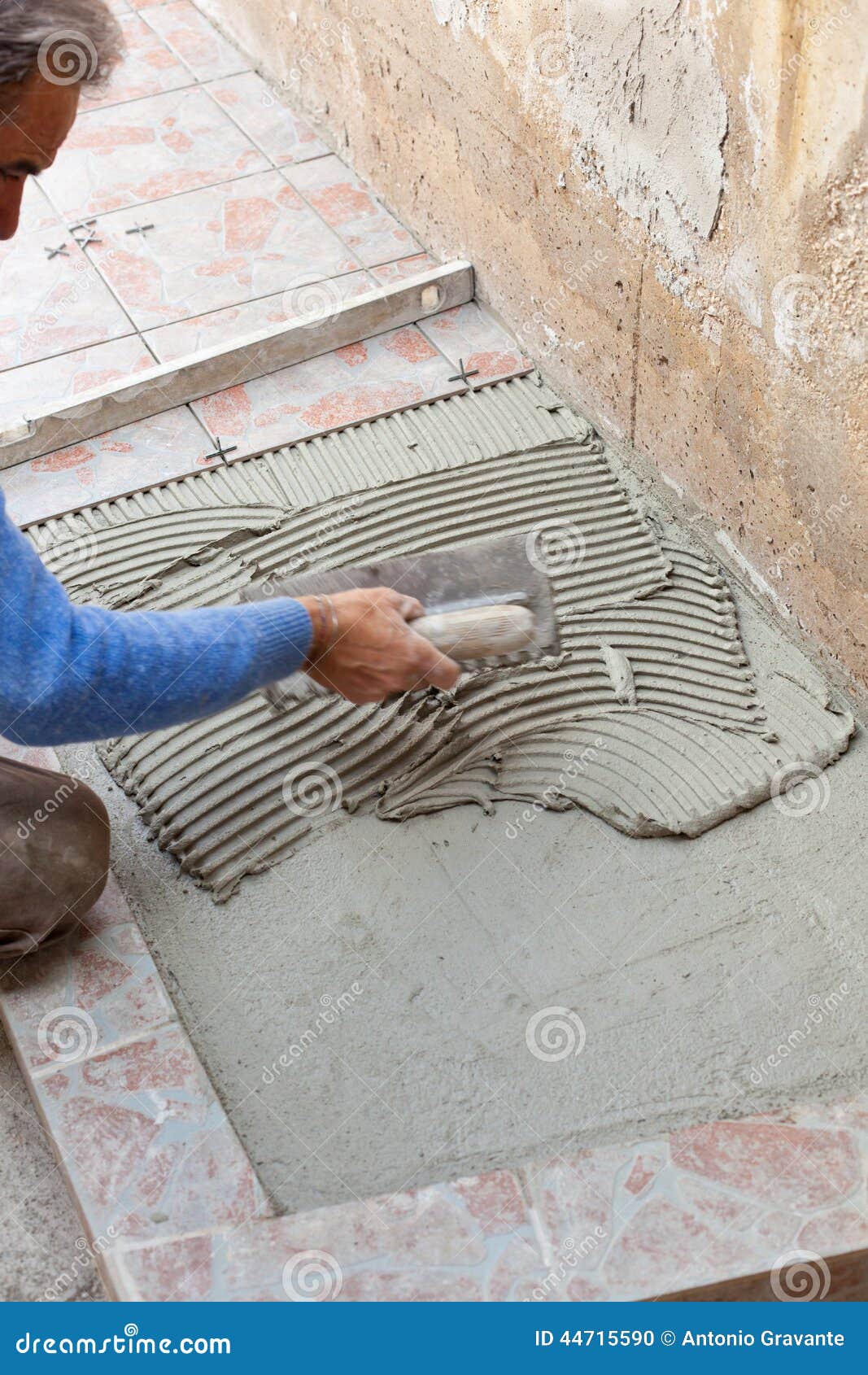 Tiler works with flooring. stock photo. Image of brick - 44715590