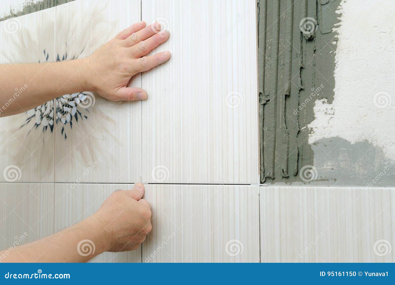 Tilers Hands are Installing a Ceramic Tile. Stock Photo - Image of ...