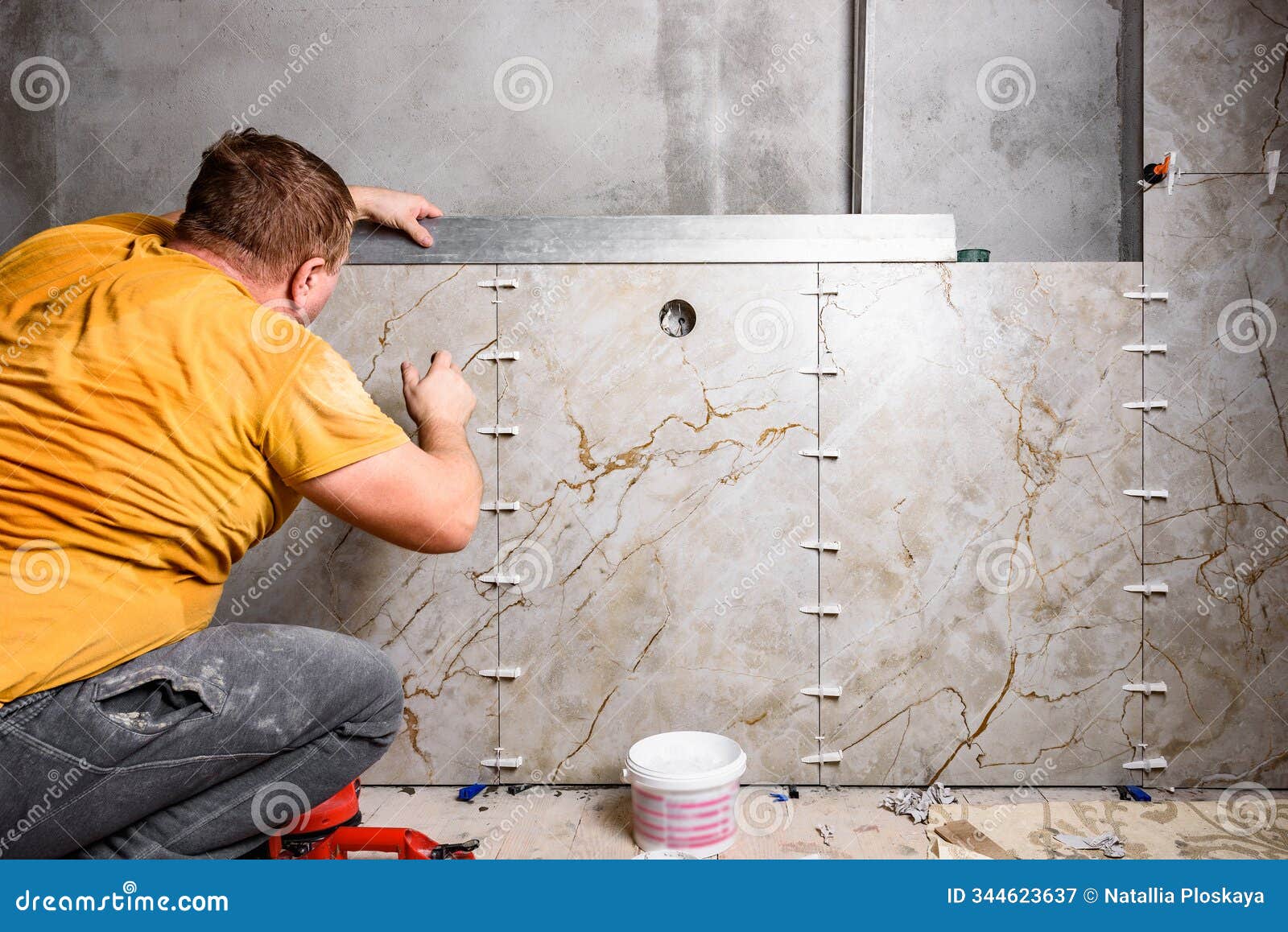 Tilers Installing Large Format Tiles on Wall. Stock Image - Image of ...