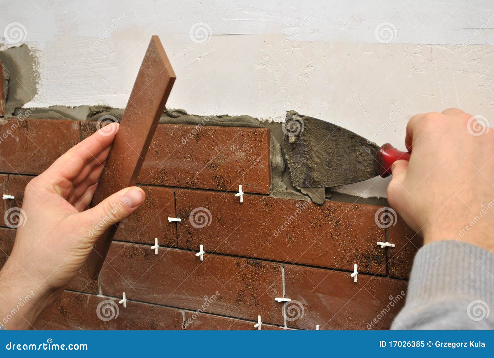 Tiling a Wall stock image. Image of tiler, worker, spatula - 17026385