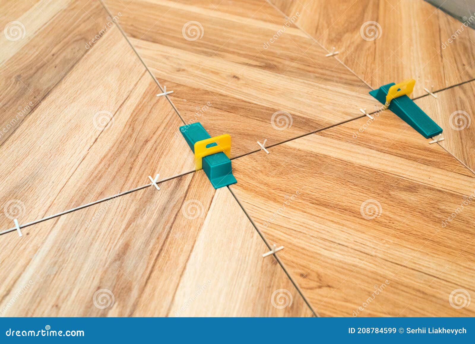 Tiling Work. Layed Tiles with Crosses for Tiles and 3d Crosses Stock ...