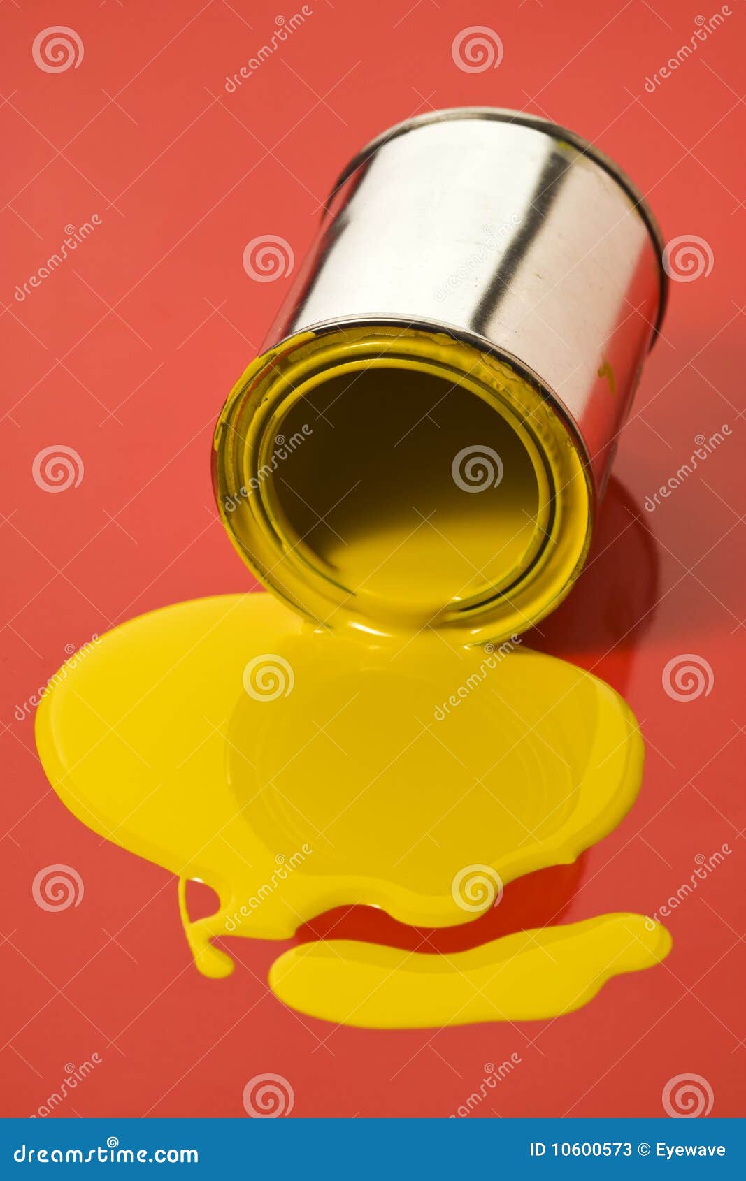 Tilted Can with Yellow Paint on Red Surface Stock Image - Image of ...