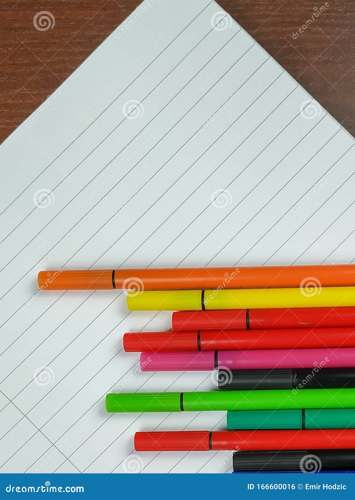 Tilted Empty White Notebook with Lines and Colorful Pens on Top for ...