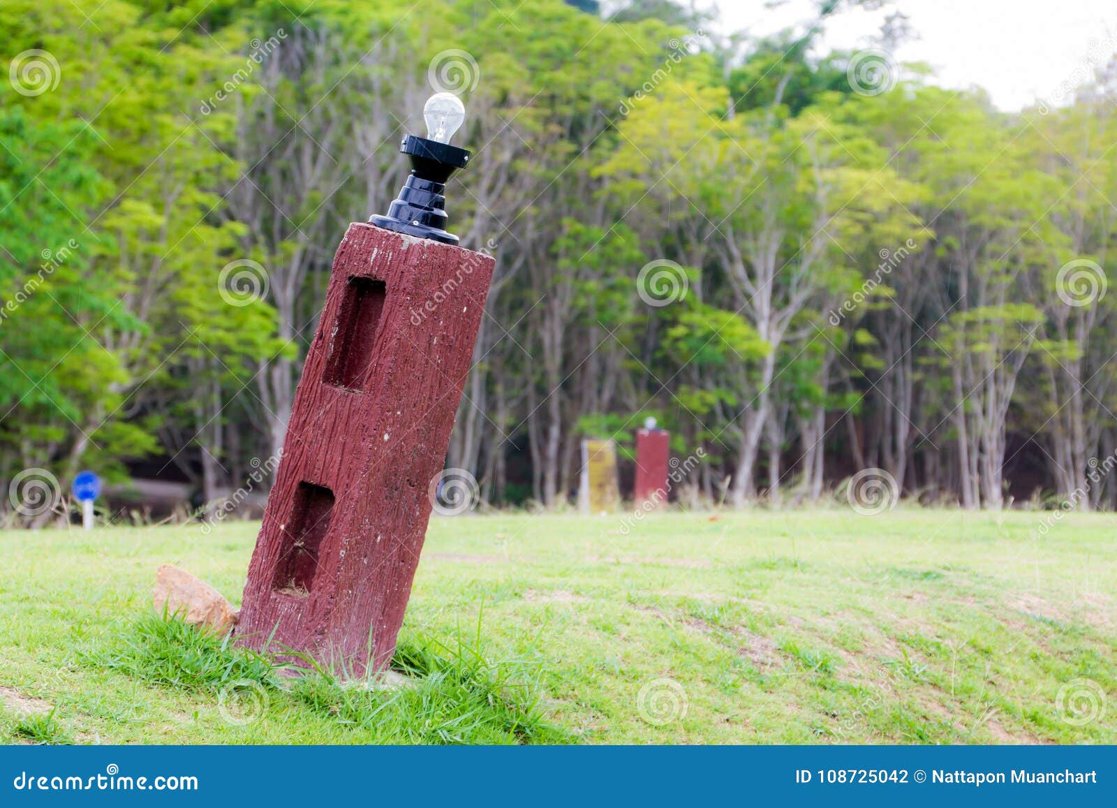 Tilted Light Pole in Green Garden Stock Photo - Image of electric ...