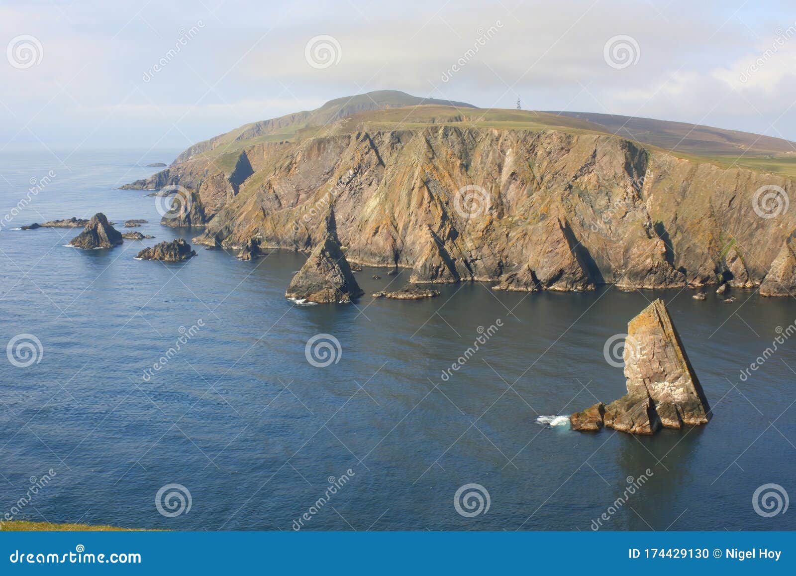 Tilted Triangular Strata in Sea Cliffs Stock Photo - Image of fair ...