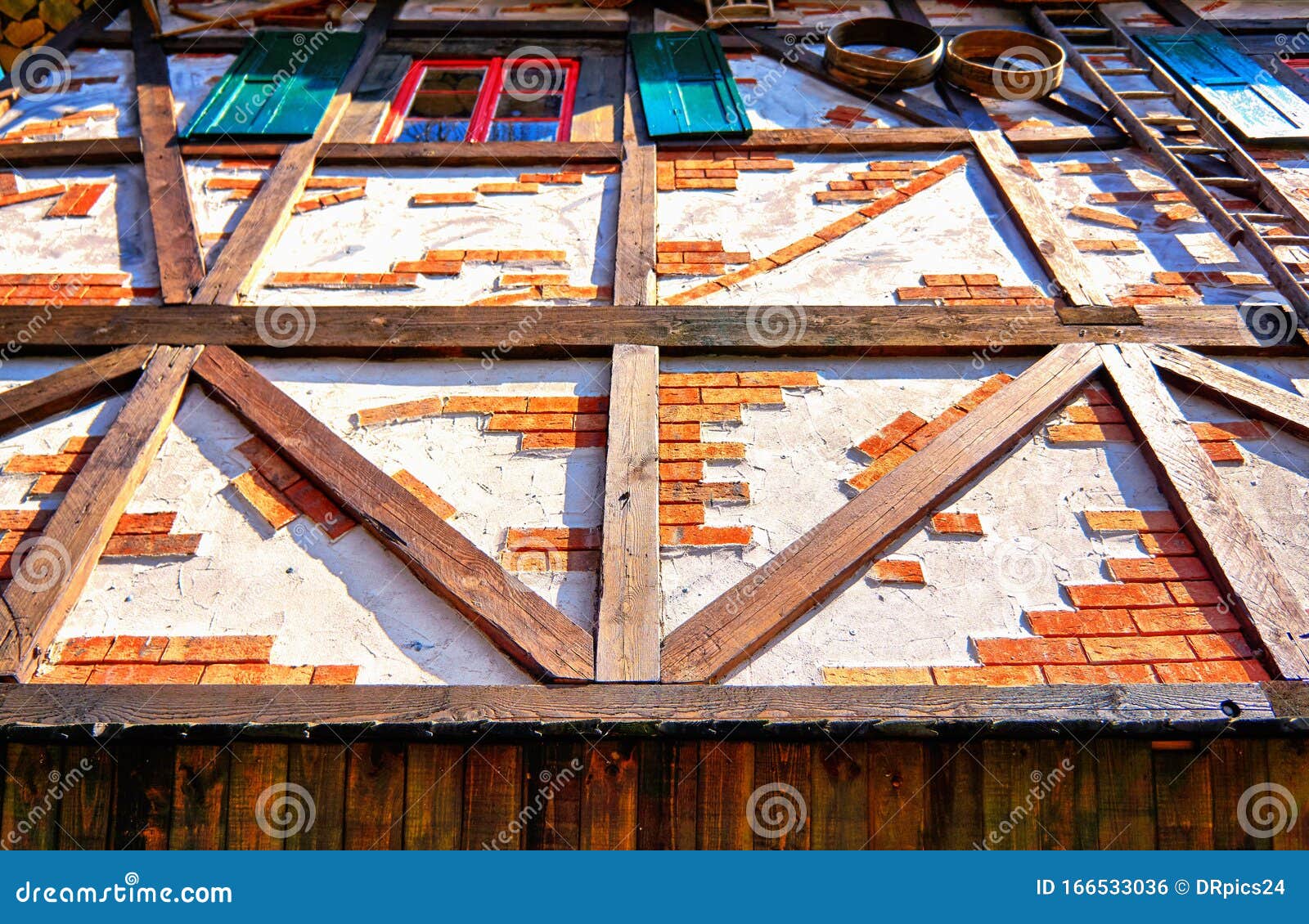 Timber Frame Made of Wood with Red Bricks and Windows Stock Photo ...