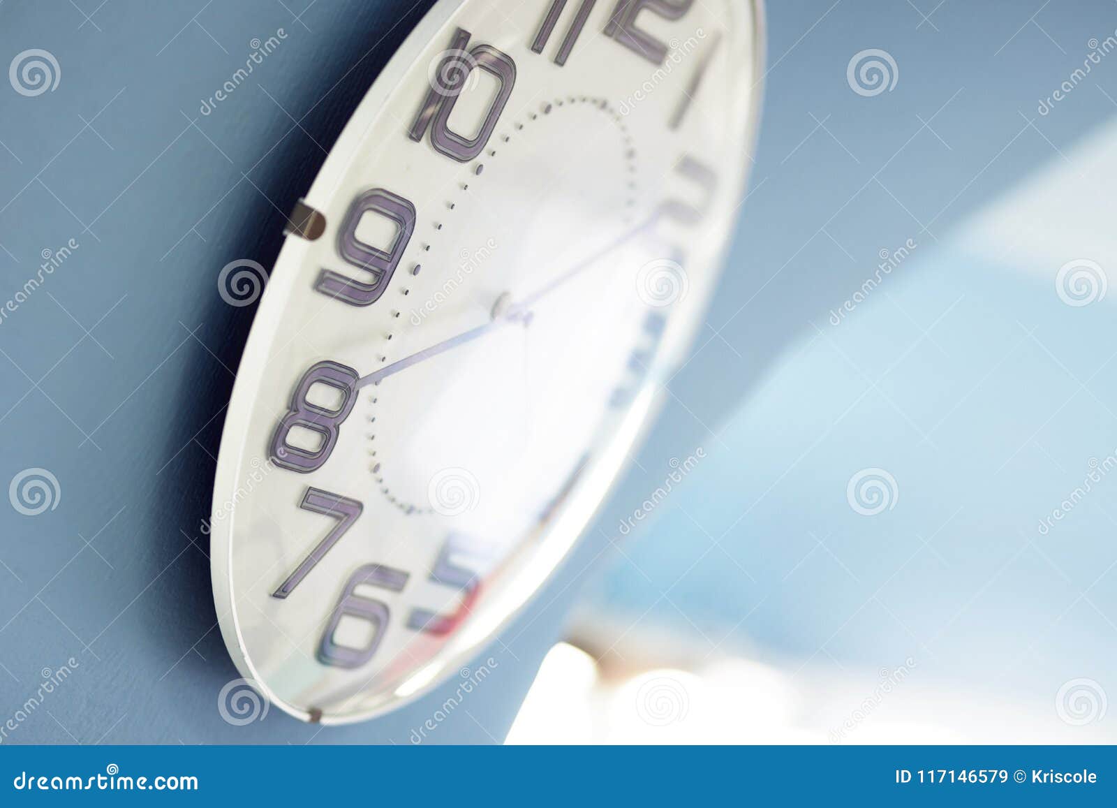 Time. Clock with White Dial on Blue Wall. Side View, Little Depth of ...