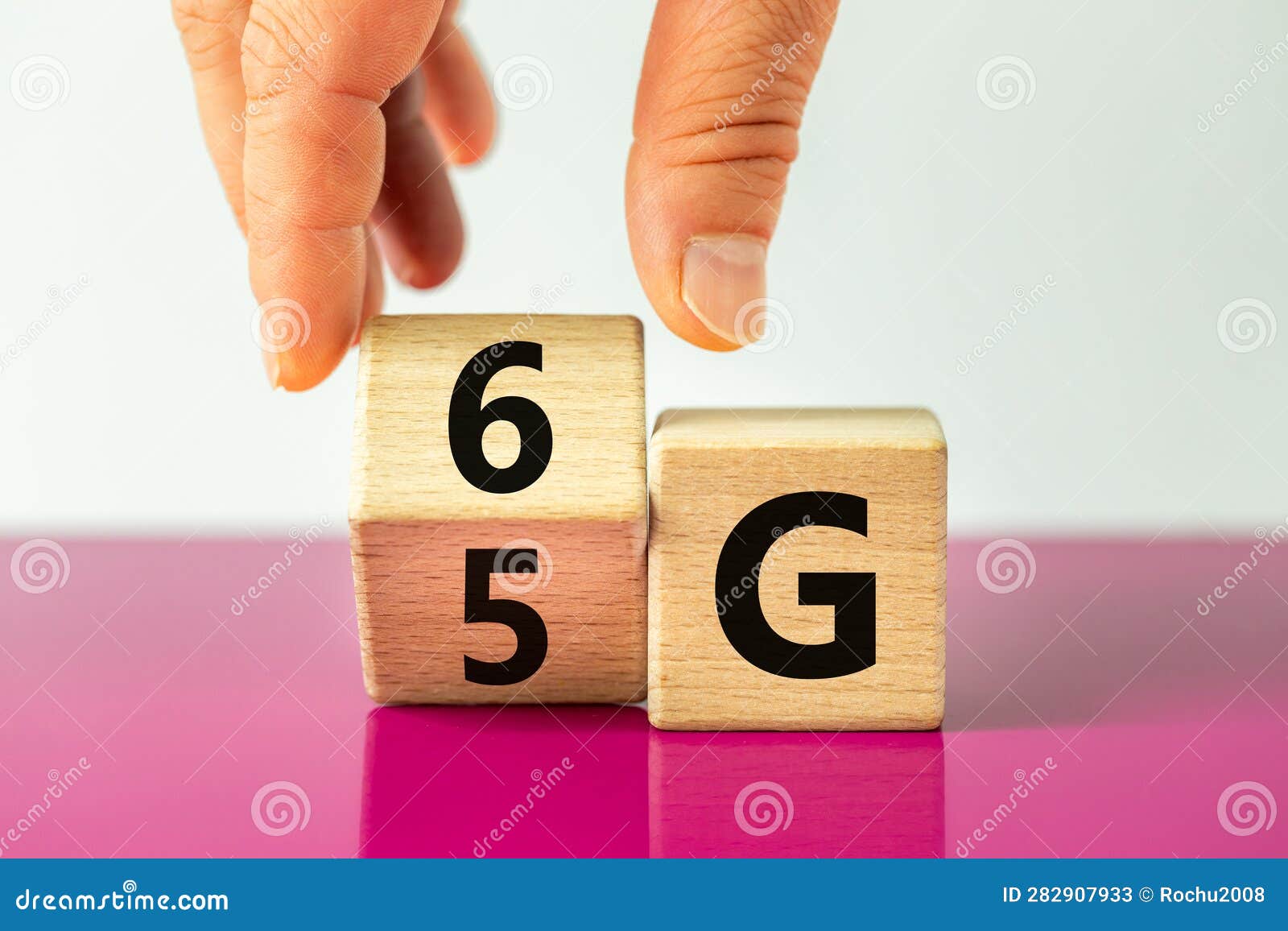 Time for the 6G Symbol. the Hand Rotates the Wooden Cube and Changes ...