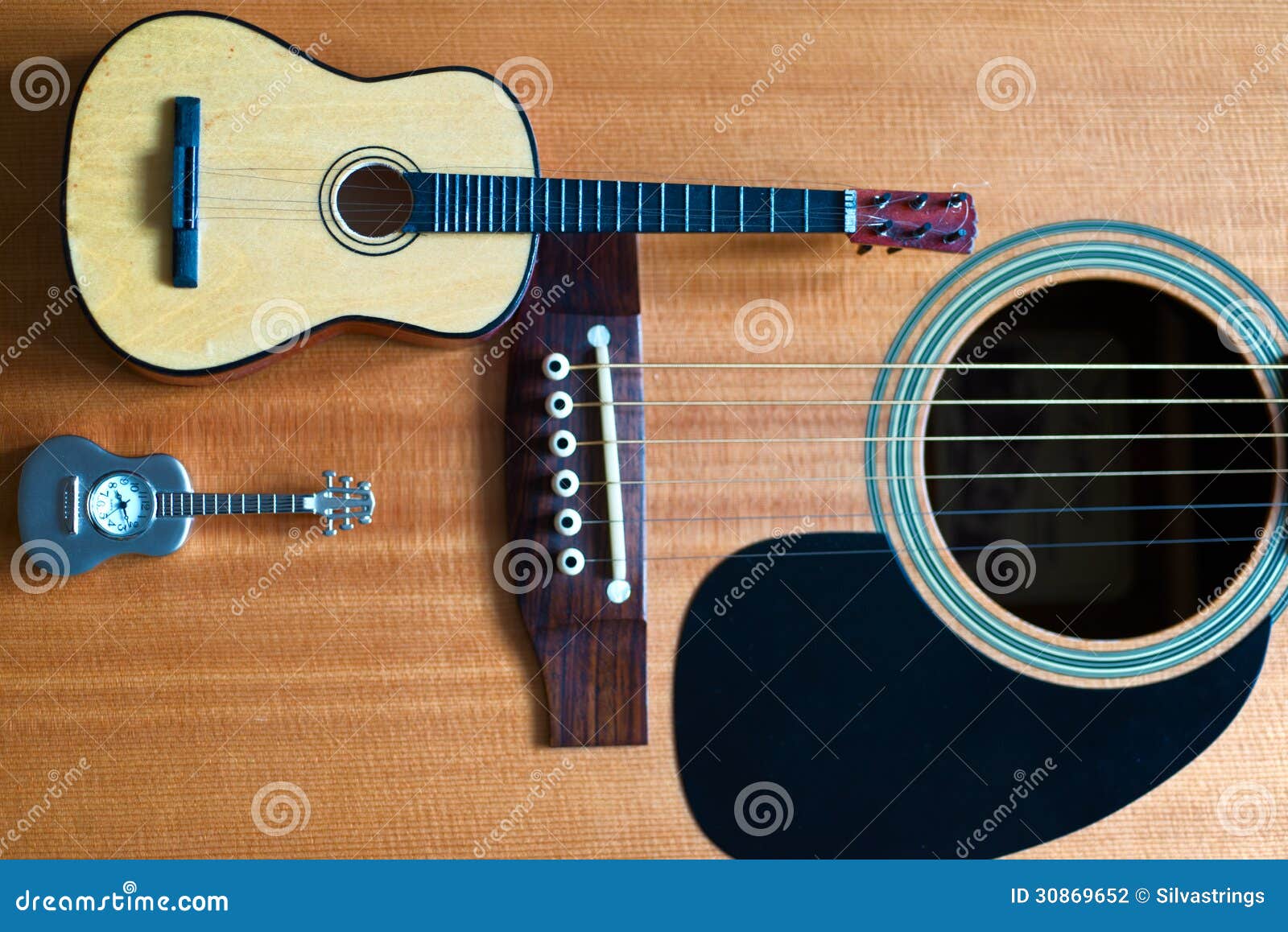 Three guitars together stock photo. Image of clock, large - 30869652