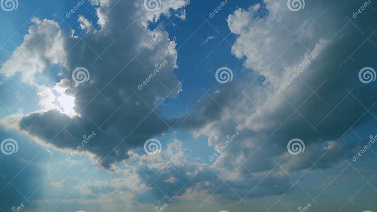 Building Clouds and Sun Rays Breaking through Cloud Mass. Flares Shinning through Dramatic ...