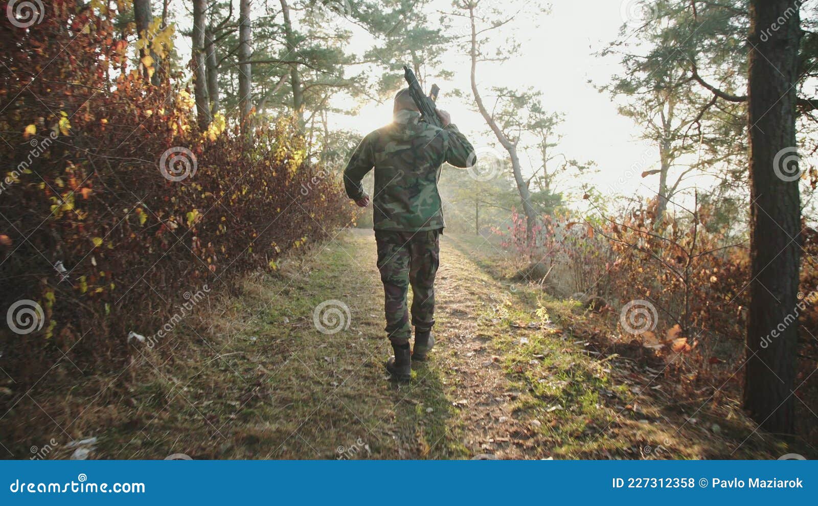Time Lapse Interval of Soldier Walk in Forest at Sunset with Rifle on ...