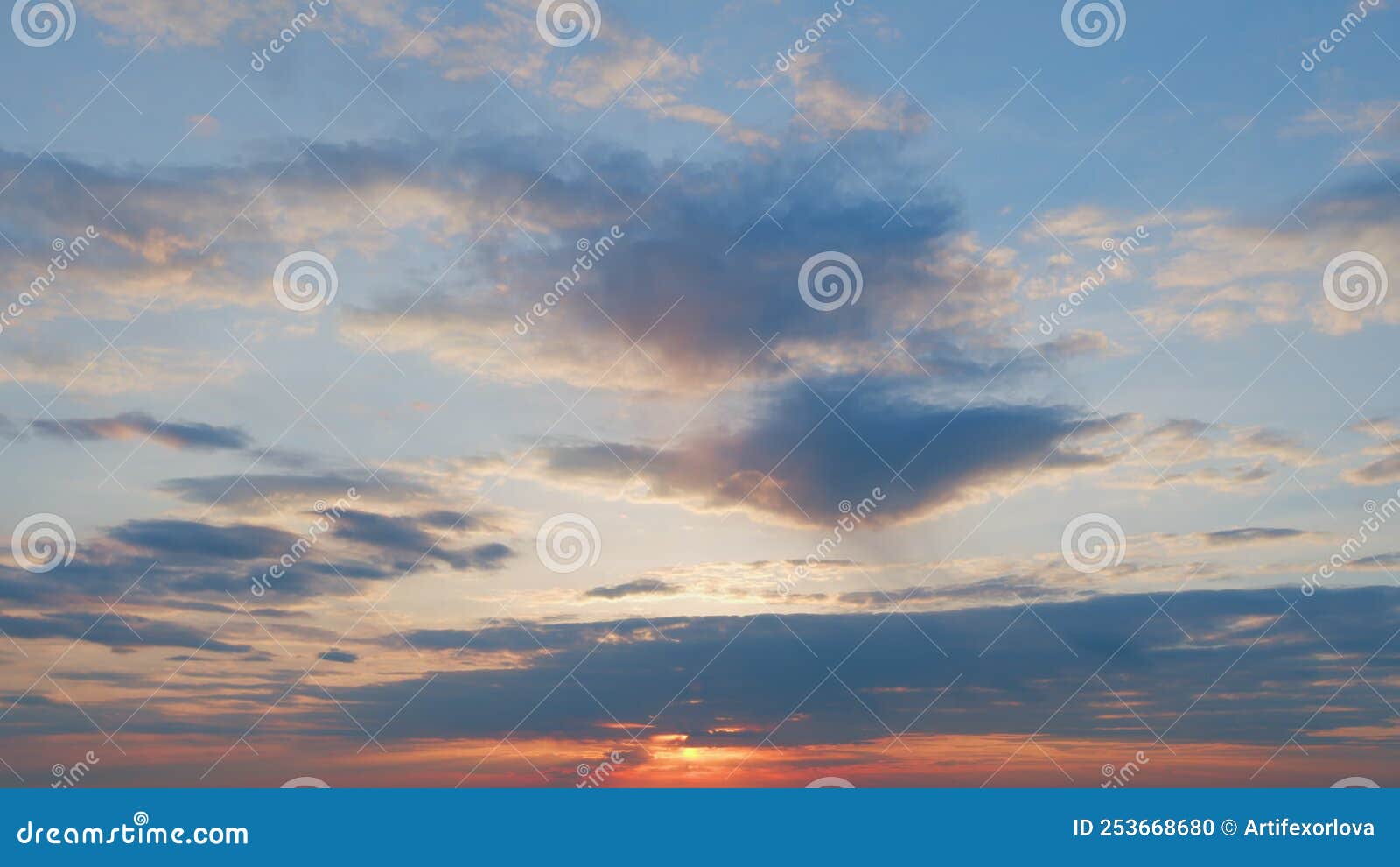 Landscape of Clouds Moving Across the Sky Against the Setting Sun ...