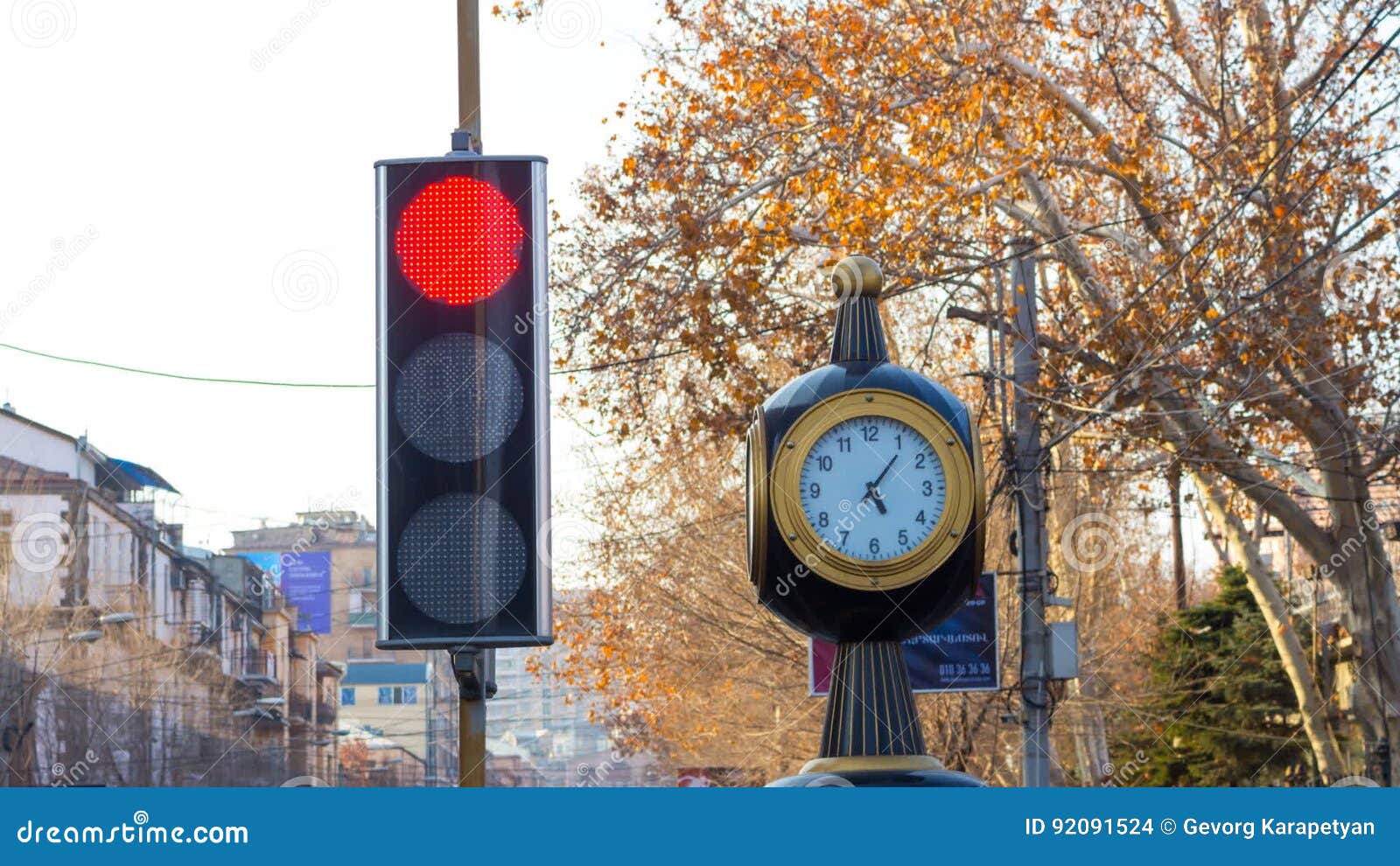 Time Lapse: Traffic Lights with a Clock on the City Background Stock ...