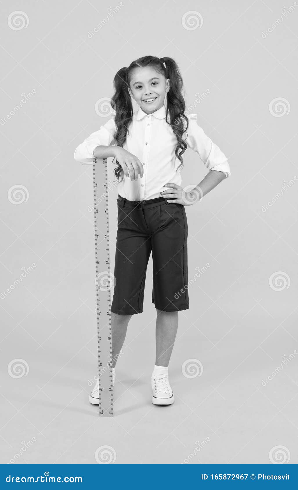 Time for Learning. Small School Child with Ruler Learning Maths and ...